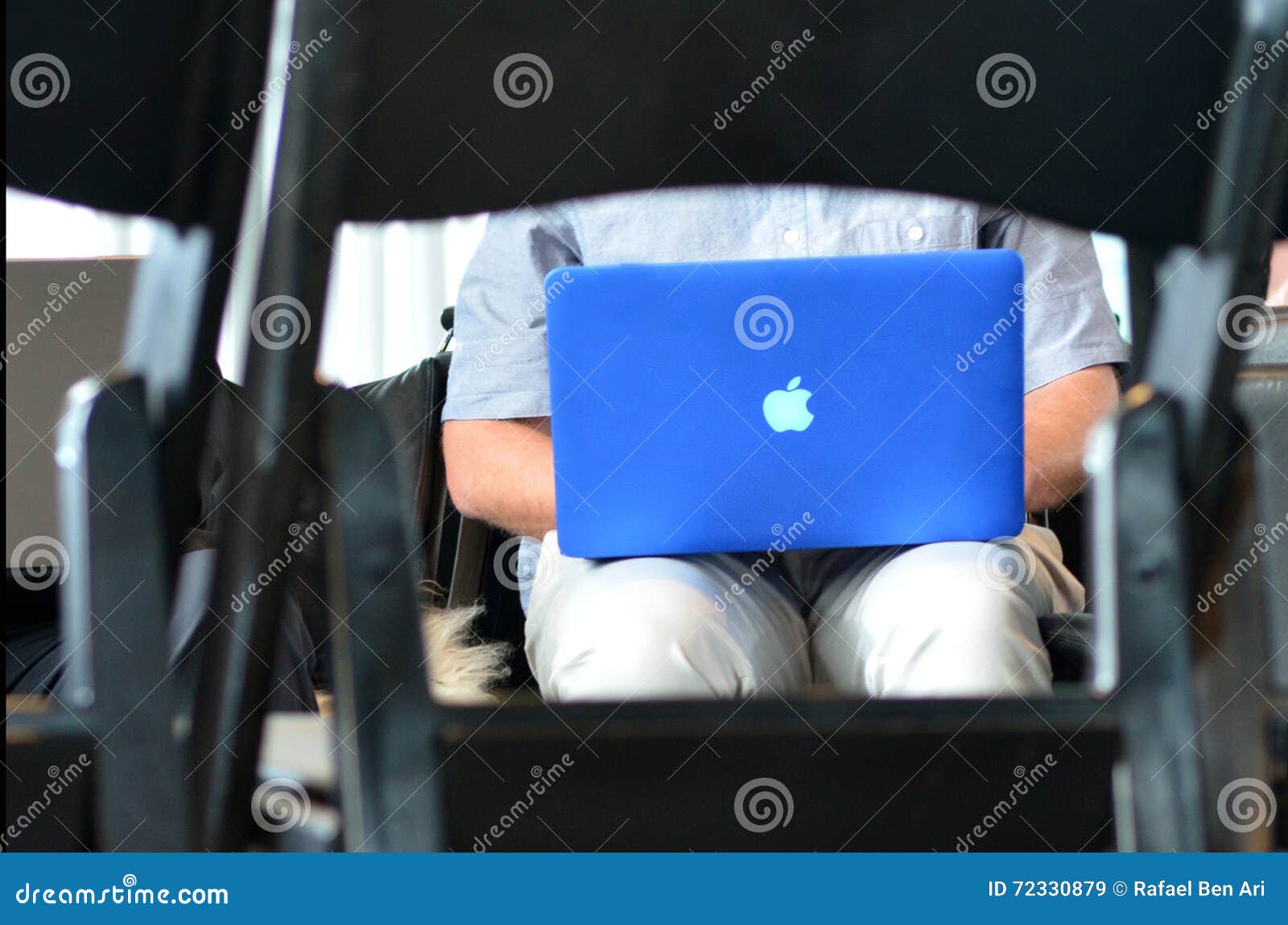Man works on Apple laptop editorial stock image. Image of blogger ...