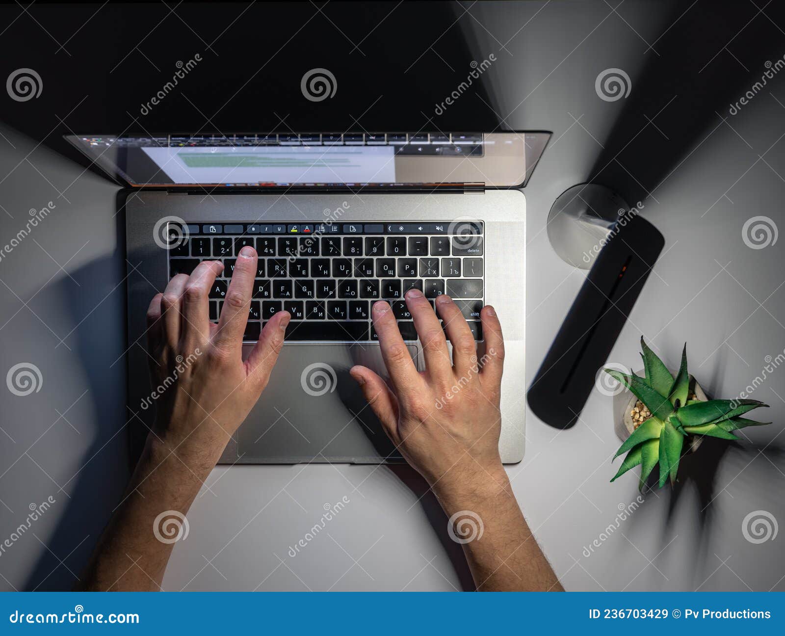 A Man Works at a Computer at Night, Top View. Stock Image - Image of ...