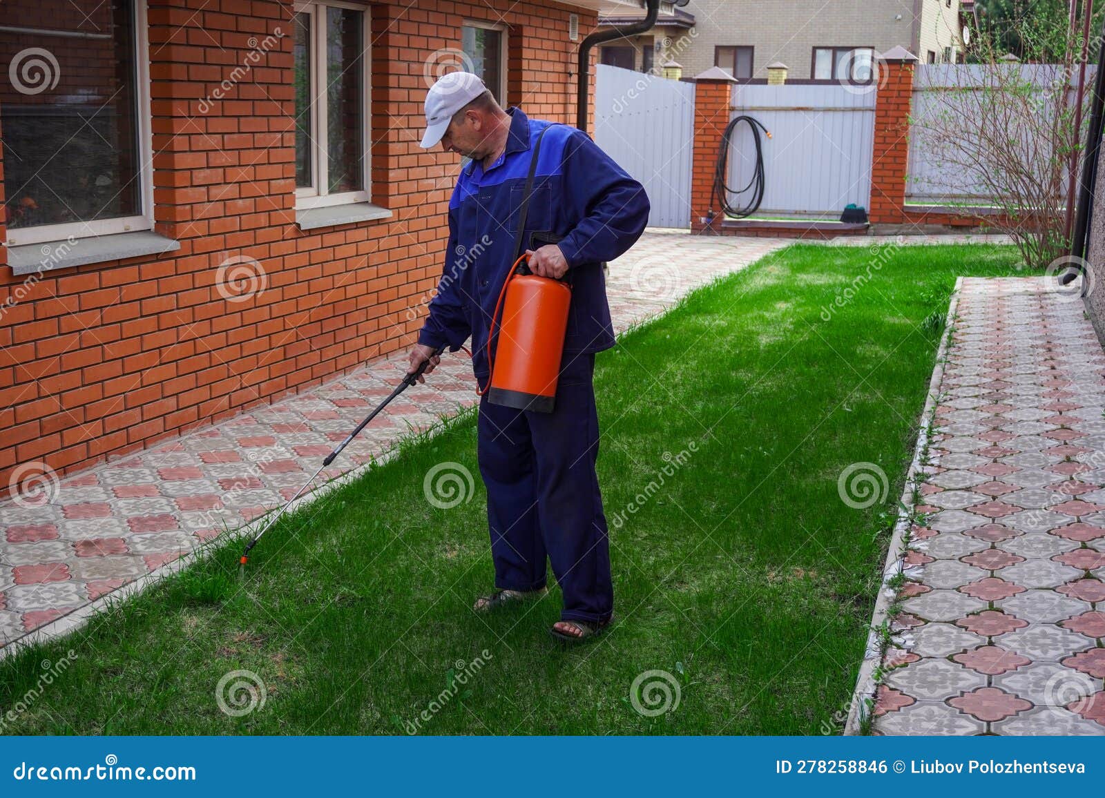 A Man Works in the Garden, Spraying Weeds from a Sprayer Stock Photo ...