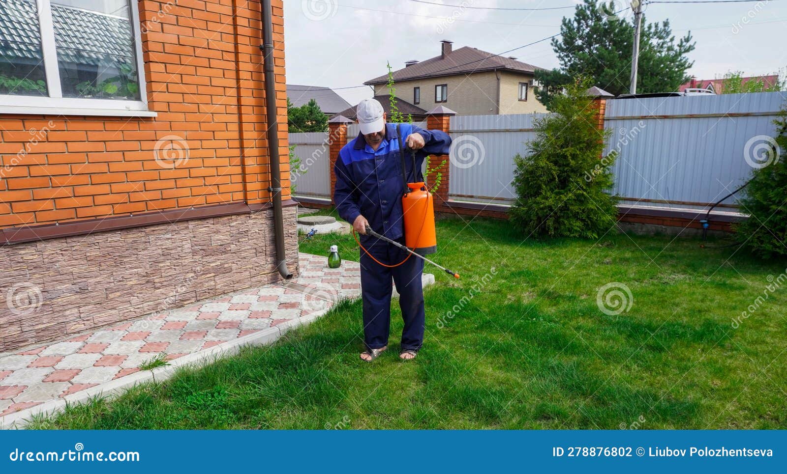 A Man Works in the Garden, Spraying Weeds from a Sprayer Stock Photo ...