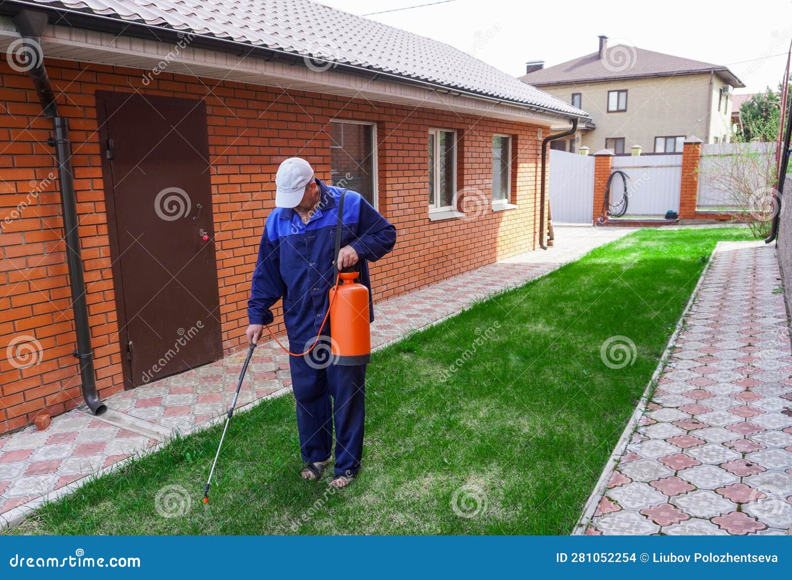 A Man Works in the Garden, Spraying Weeds from a Sprayer Stock Photo ...