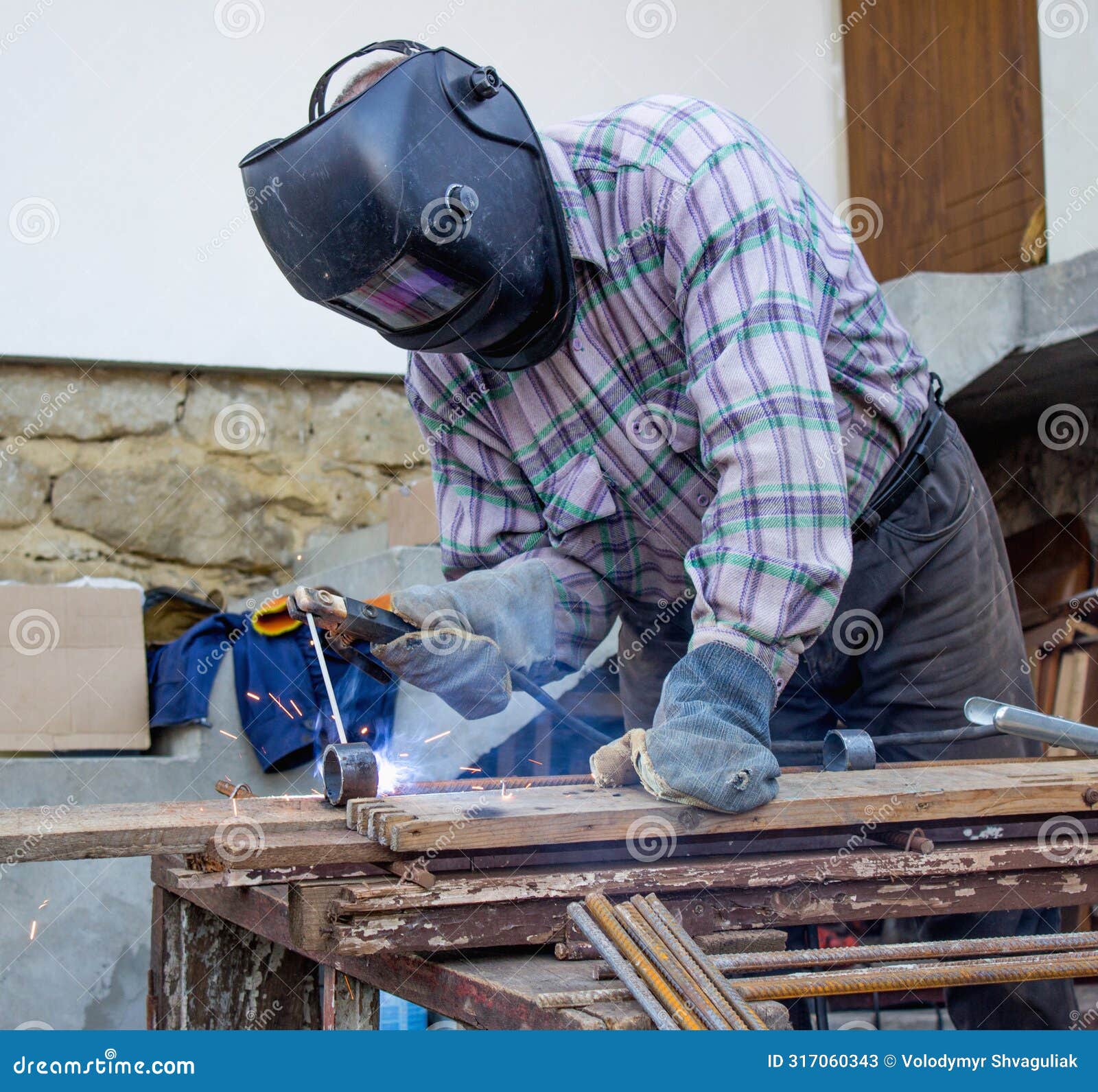 Work in the Industry. a Man Works with a Welding Machine Stock Image ...