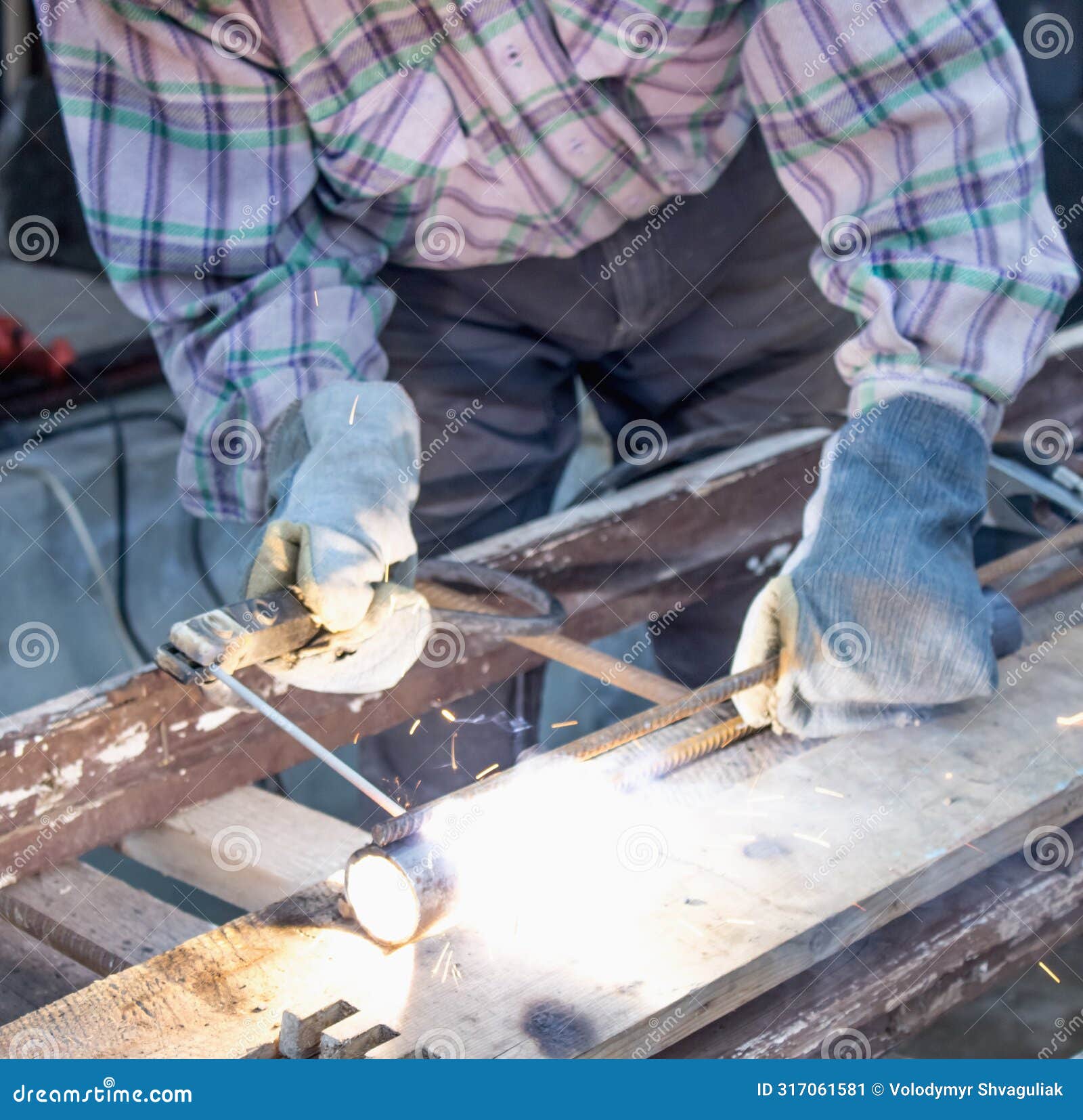 Work in the Industry. a Man Works with a Welding Machine Stock Image ...