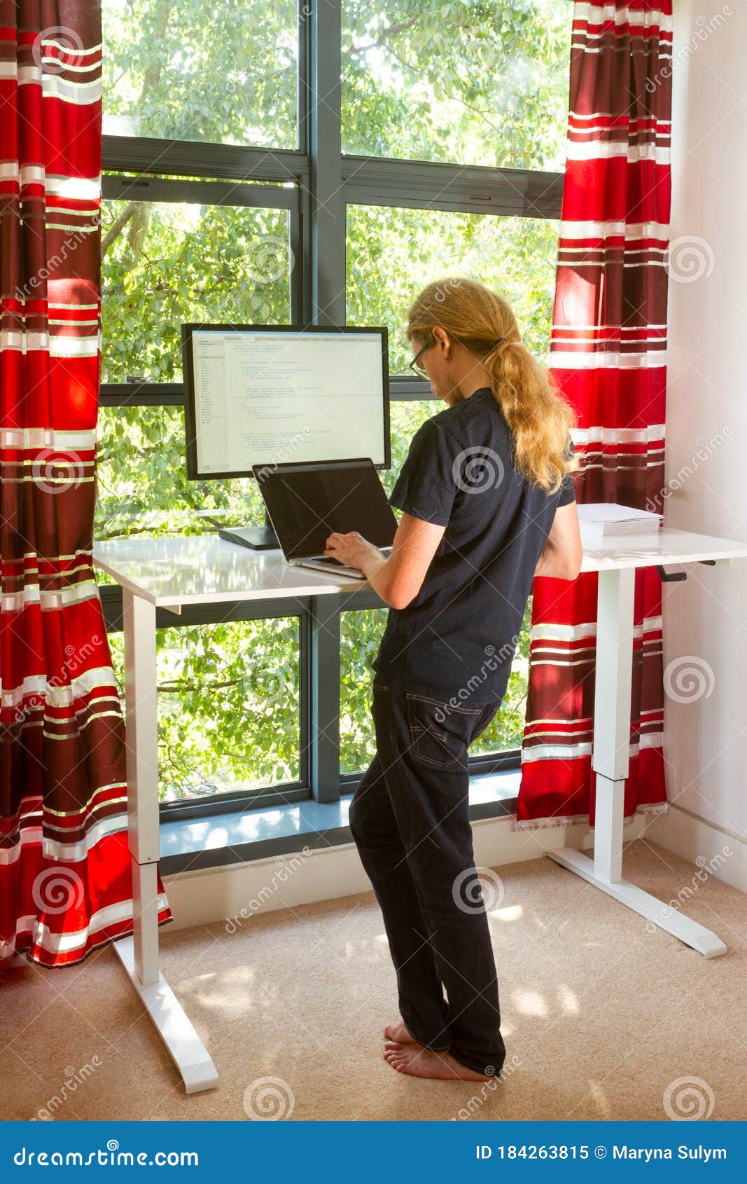 Man Works at Home Office with Laptop and Second Screen Stock Image ...