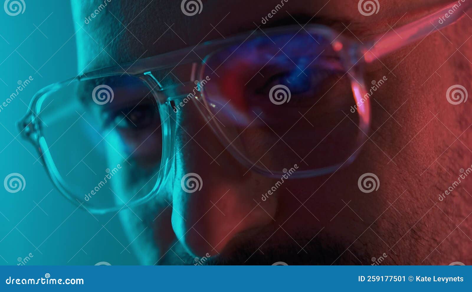 The Man Works on the Internet at Night at the Computer. Reflection in ...