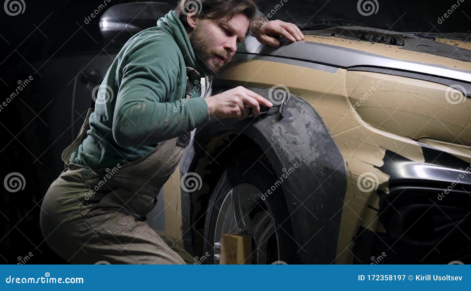 The Man Works in a Tuning Studio. Car Tuning. the Building of the Car S ...