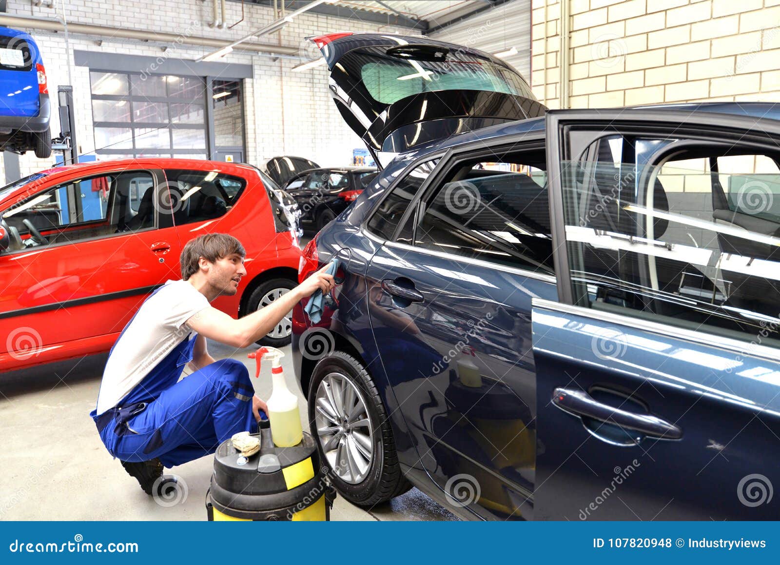 Man in a Workshop Cleaning a Car - Service for the Customer Stock Photo ...