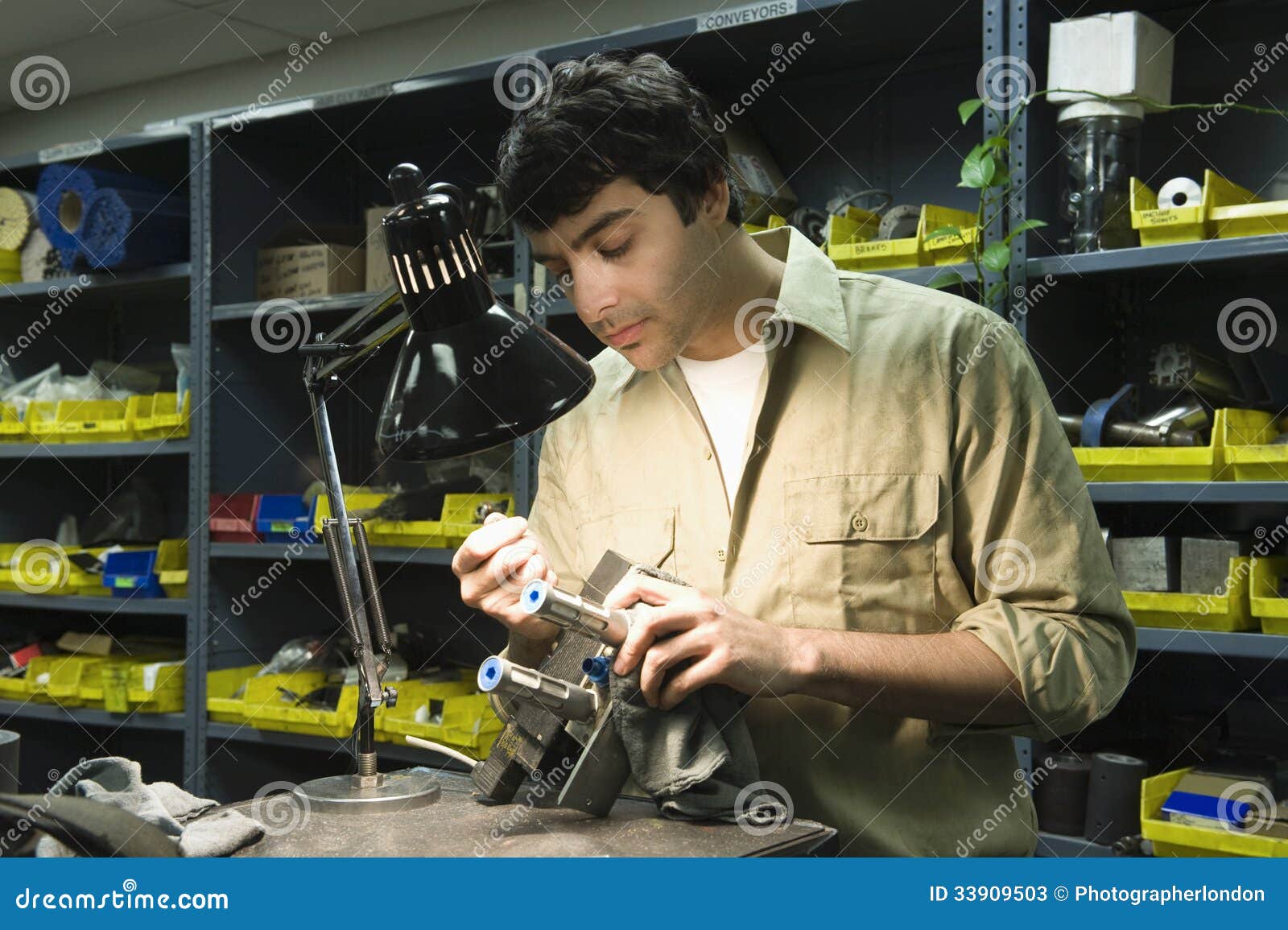 Man in Workshop with Tools stock image. Image of race - 33909503