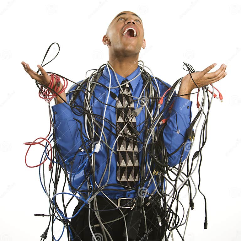 Man wrapped in cables. stock photo. Image of colour, person - 2425862