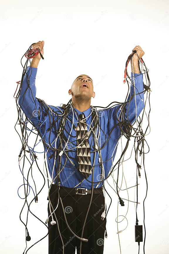 Man wrapped in cables. stock photo. Image of 070212a0157 - 2425866