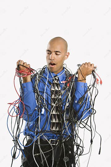 Man wrapped in cables. stock image. Image of african, confused - 2431811
