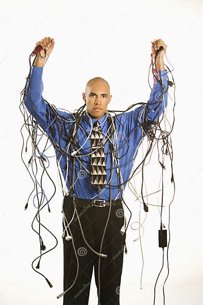 Man wrapped in cables. stock photo. Image of overwork - 2431814