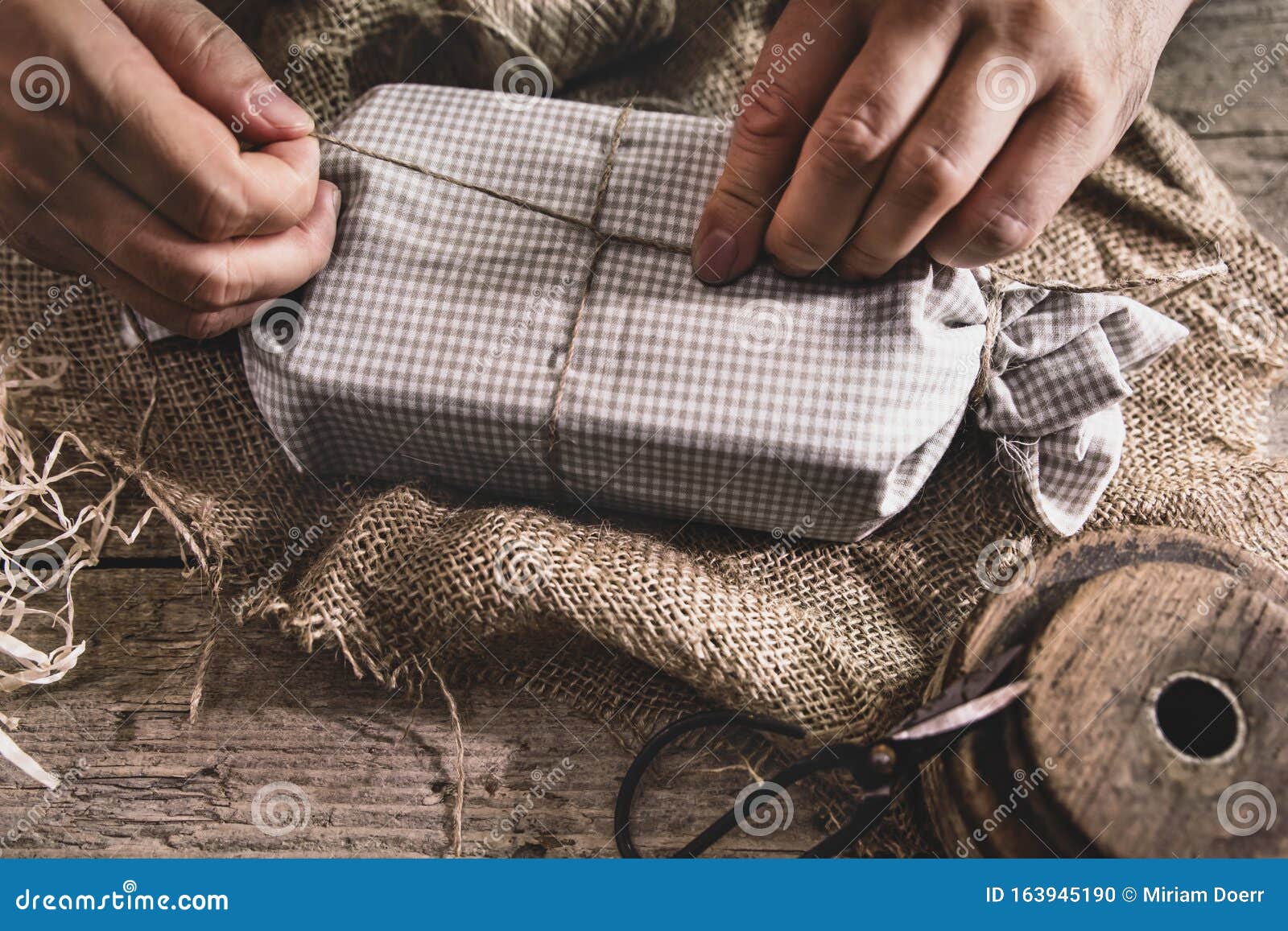 Man is Wrapping a Gift, Eco-friendly Packaging with Reusable and ...
