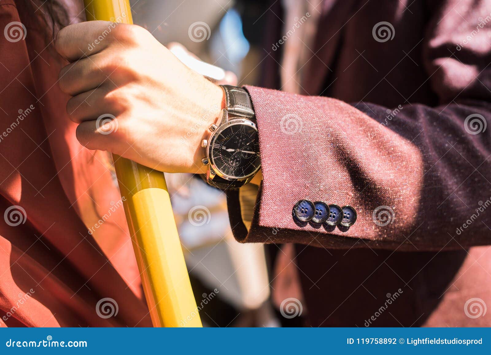 Man with wristwatch in bus stock photo. Image of indoors - 119758892