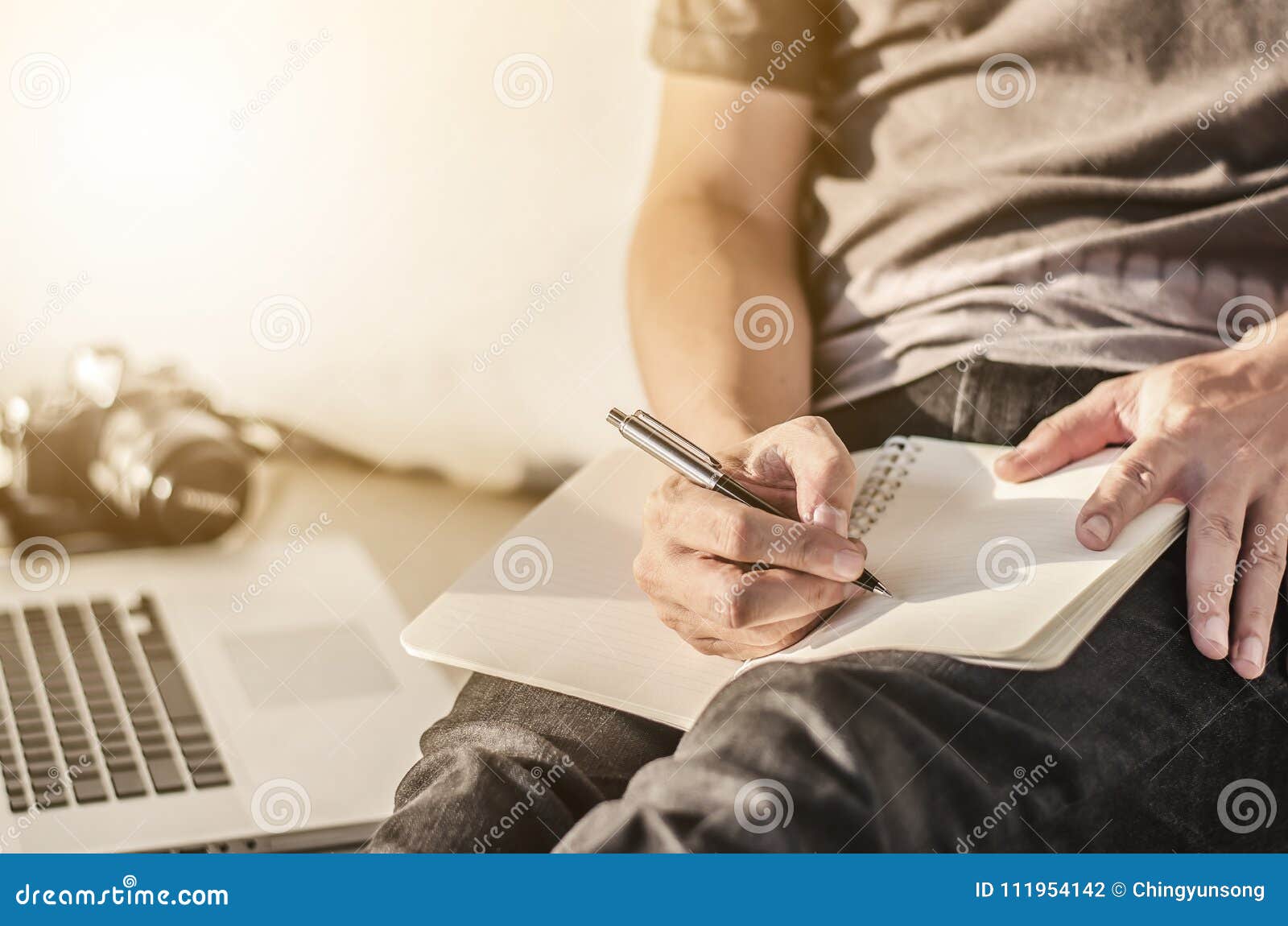 Man Write Pen on Notebook and Work on Laptop, a Man Relax Working from ...
