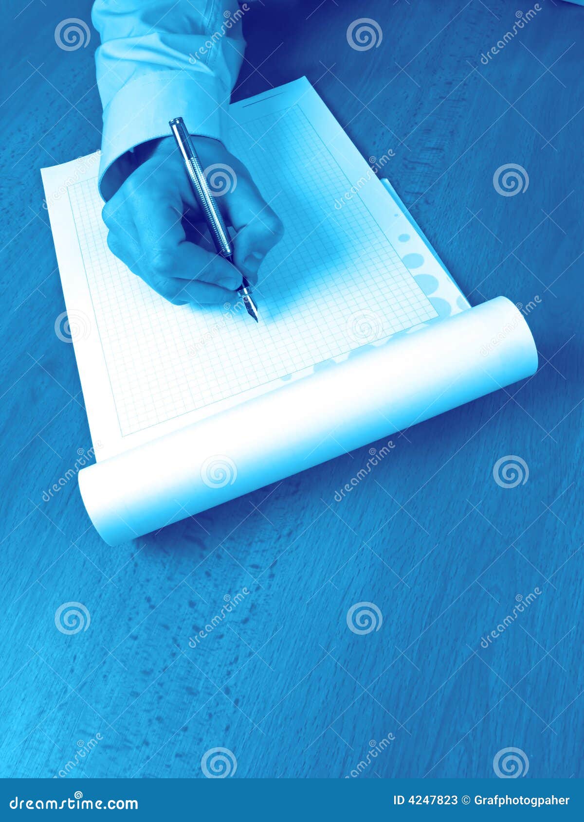 Man Writes on Blue Graph Paper Stock Image - Image of writing, paper ...