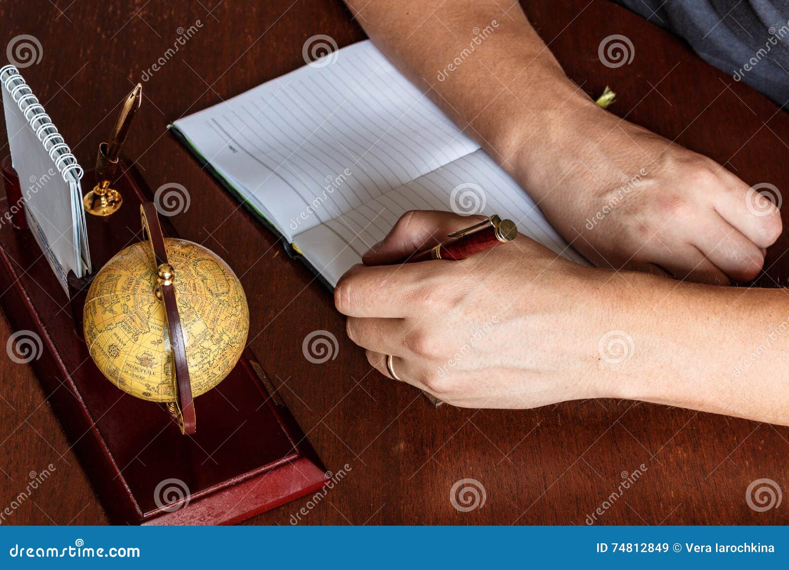 Man Writes with His Left Hand in the Diary Entries. Stock Image - Image ...