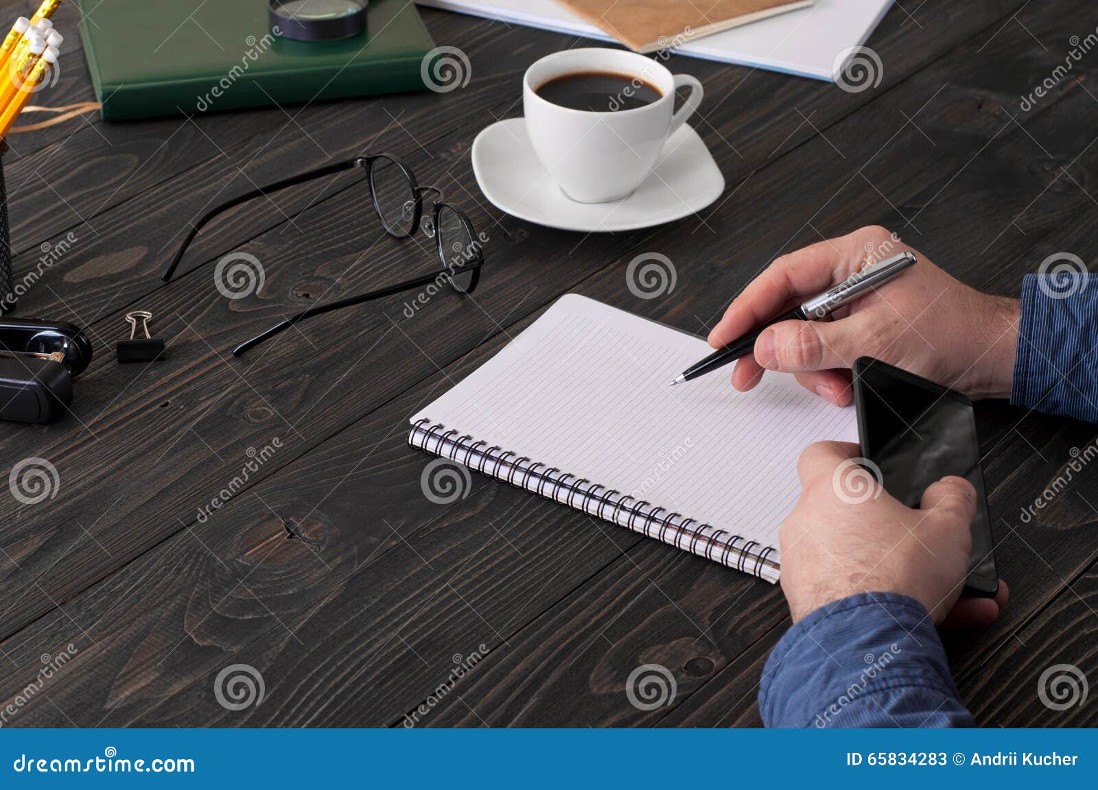 Man Writes in a Pad on a Wooden Table Stock Image - Image of lifestyle ...