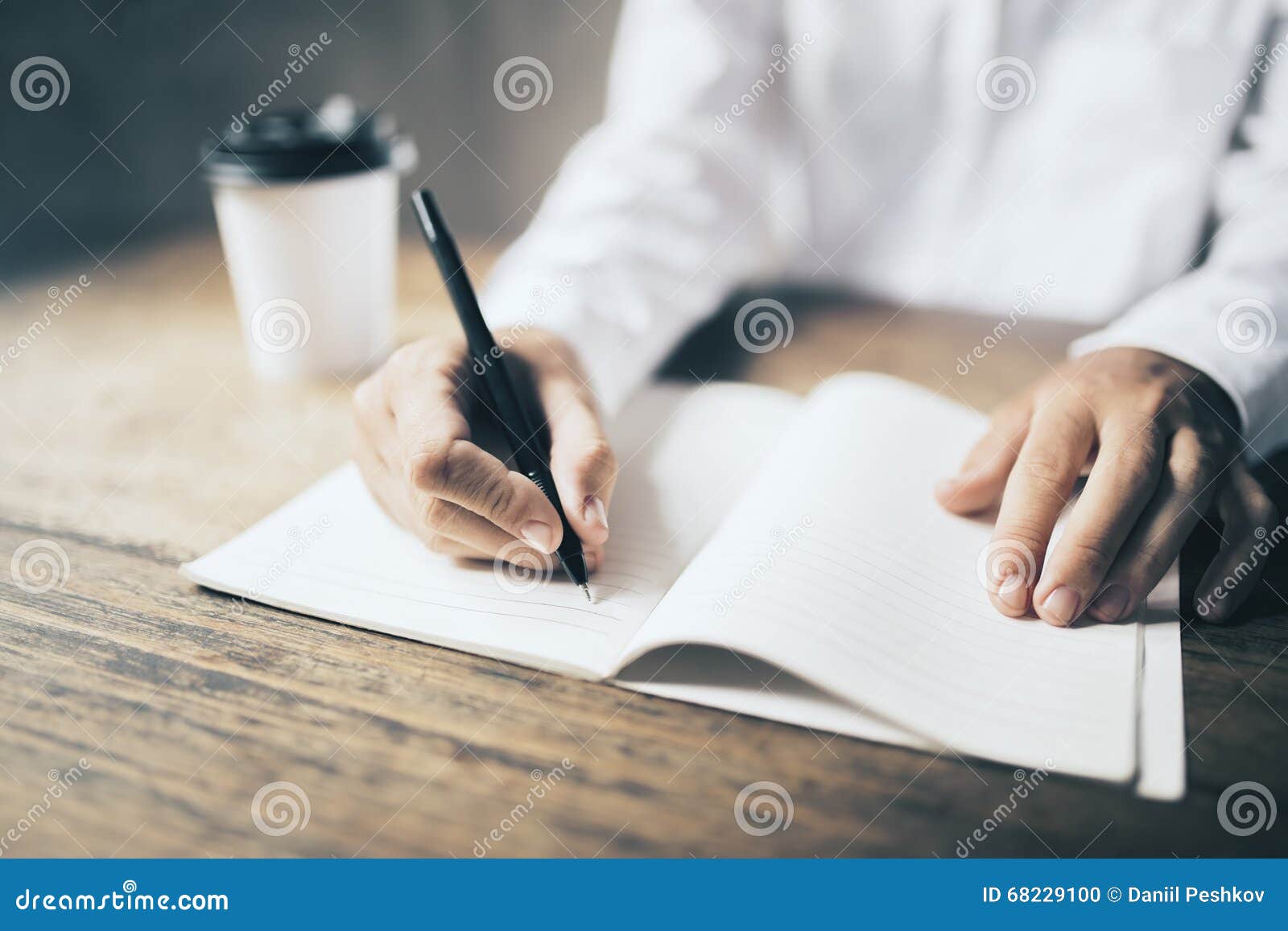 Man Writing in Blank Diary and Paper Coffee Cup on Wooden Table Stock ...