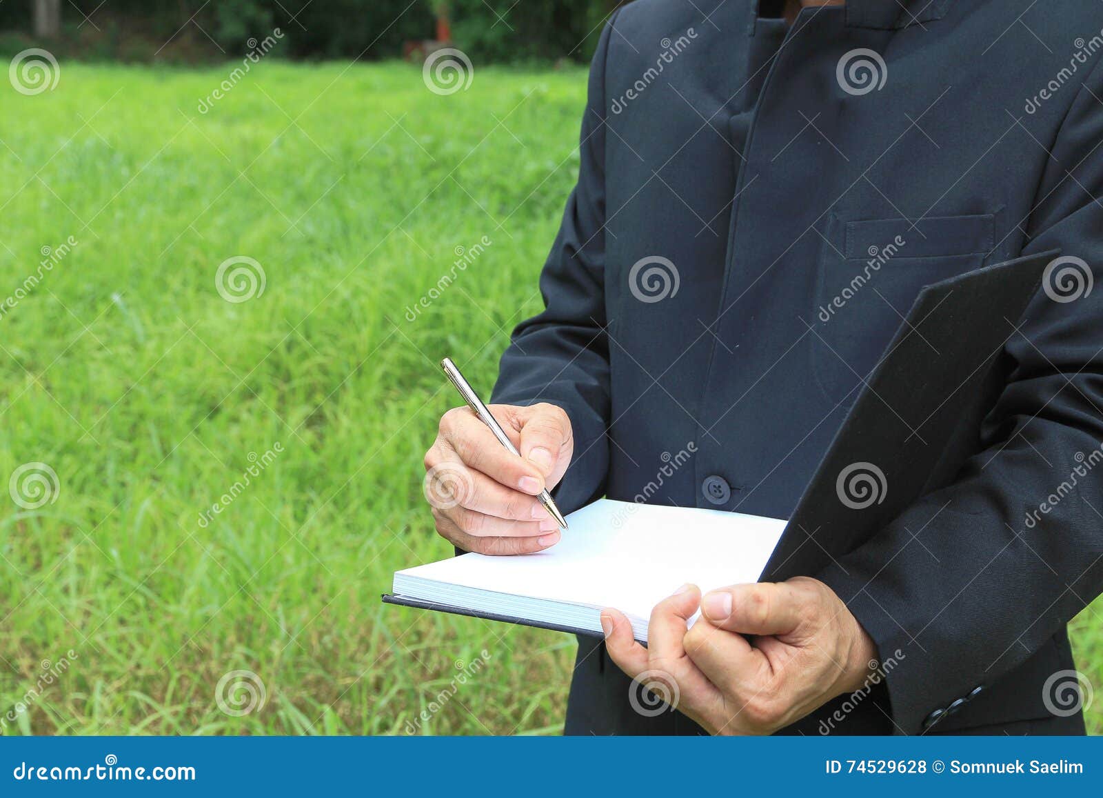 Man Writing Book Grass Background Stock Photos - Free & Royalty-Free ...