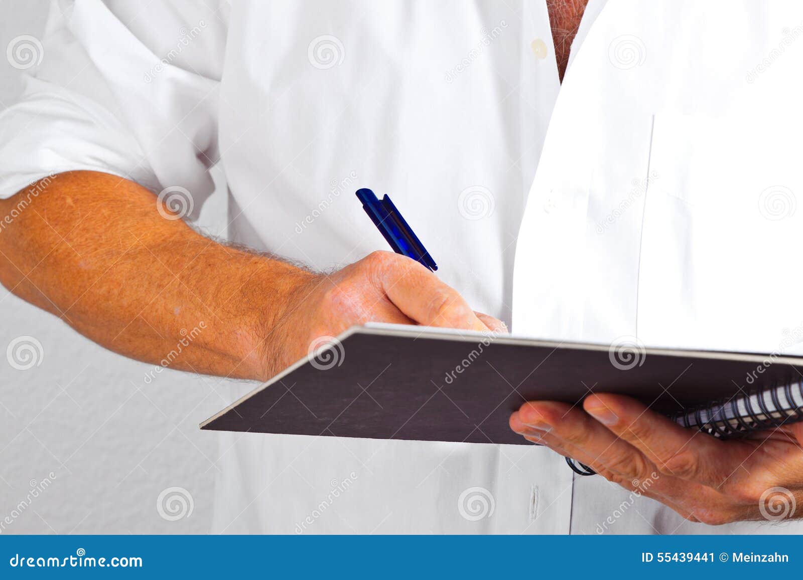 Man writing in a book stock image. Image of note, form - 55439441