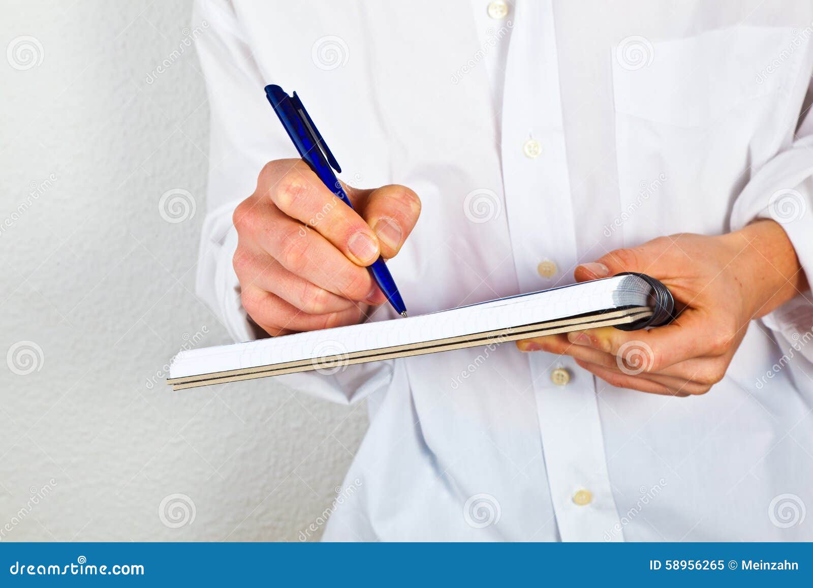 Man writing in a book stock image. Image of list, desk - 58956265