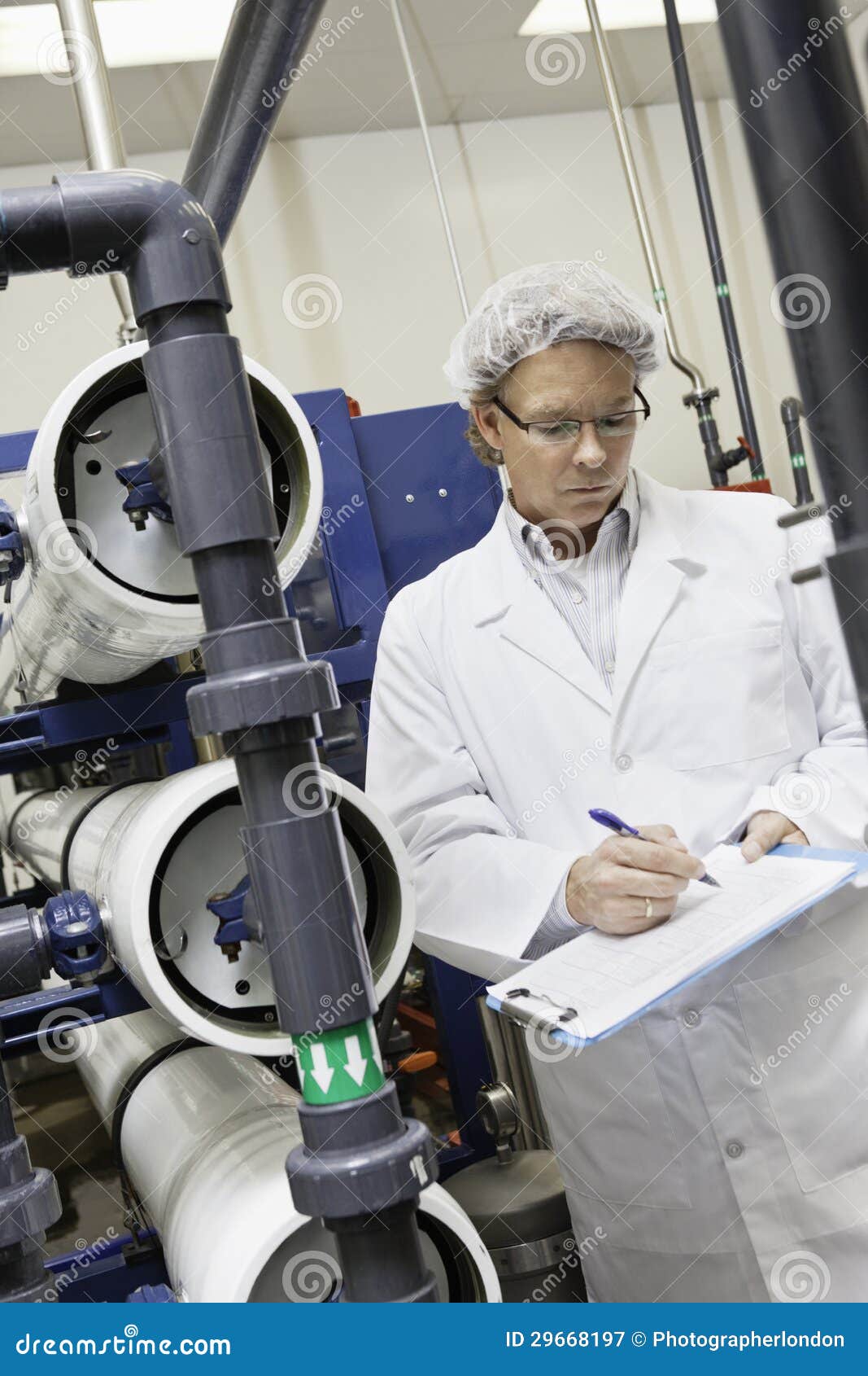 Man Writing in Clipboard while Standing in Bottling Factory Stock Image ...