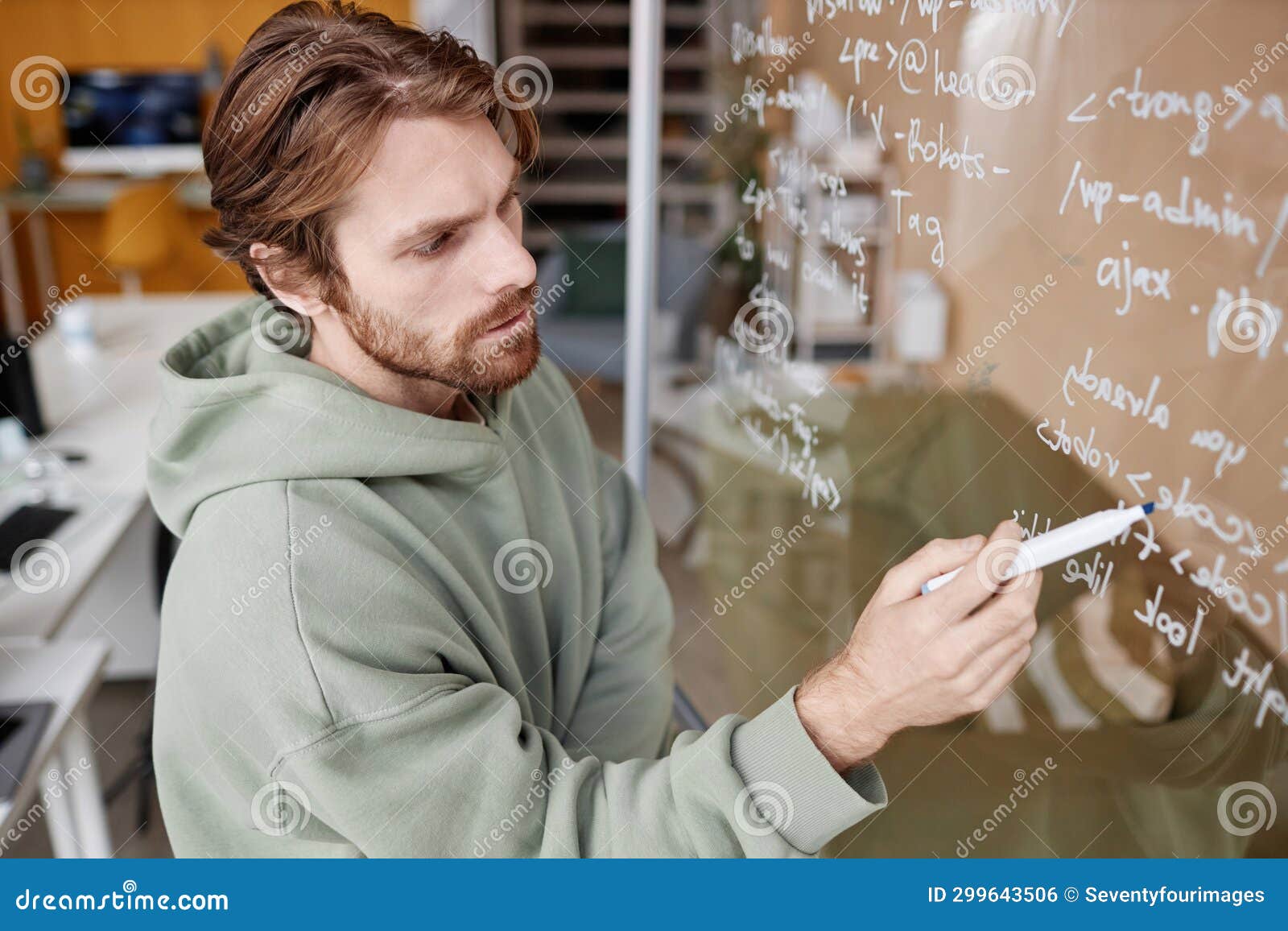 Man Writing Data Code Ideas on Glass in Office Developing New ...