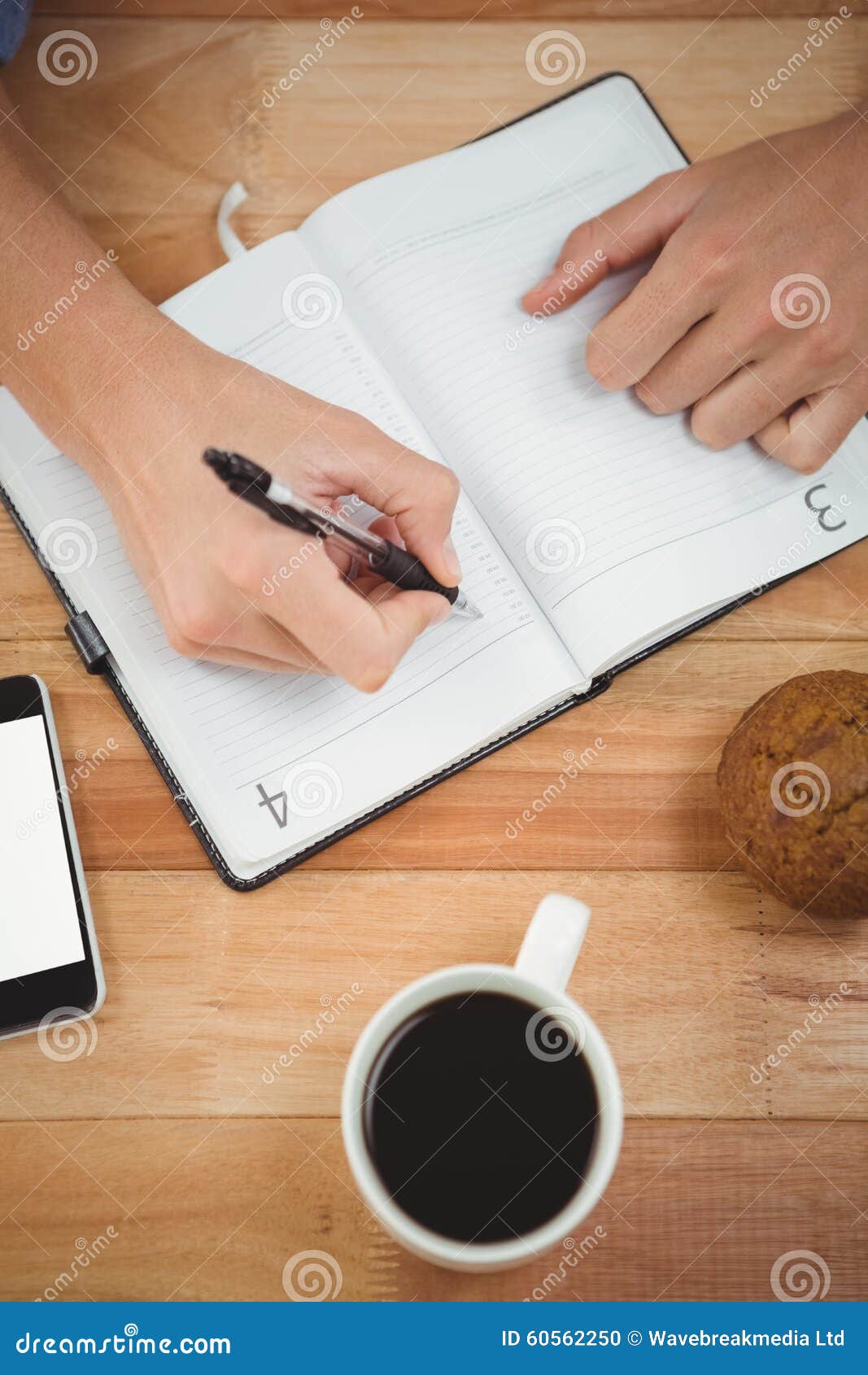 Man Writing on Diary with Muffin and Coffee at Desk Stock Photo - Image ...