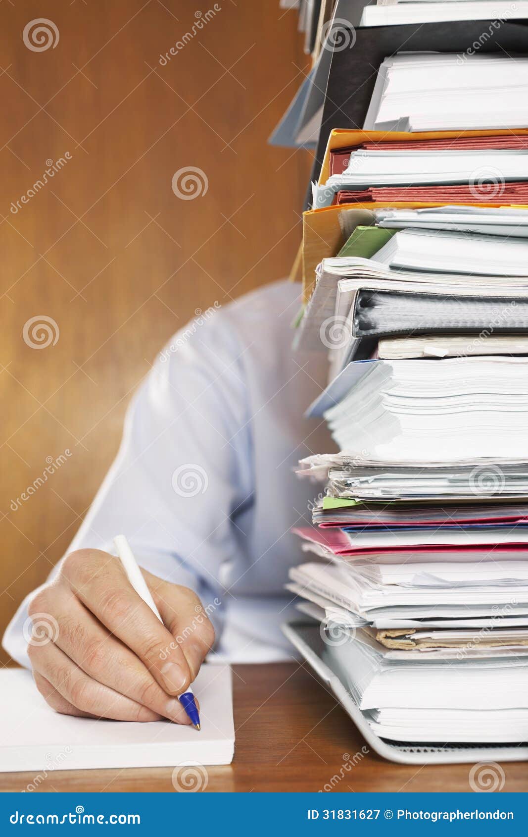 Man Writing Document Behind a Stack of Folders Stock Image - Image of ...