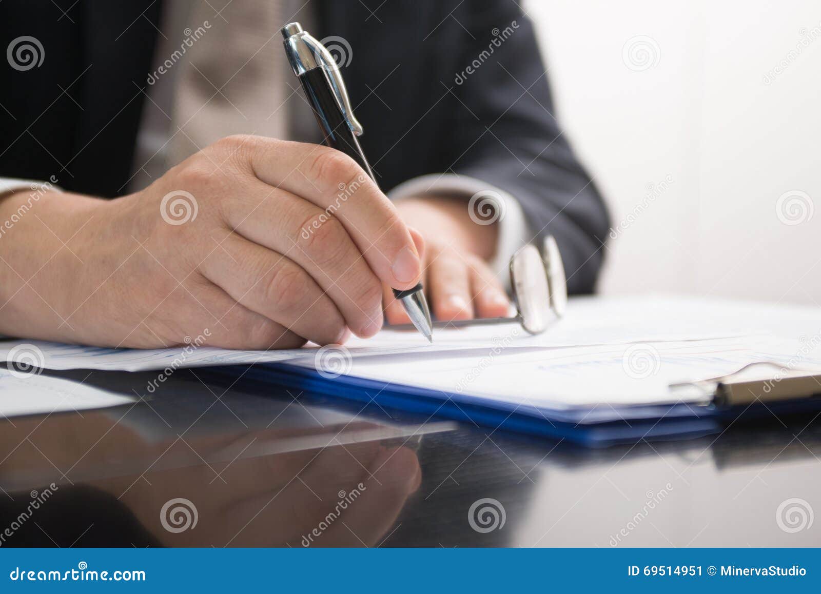 Man writing on a document stock image. Image of closeup - 69514951