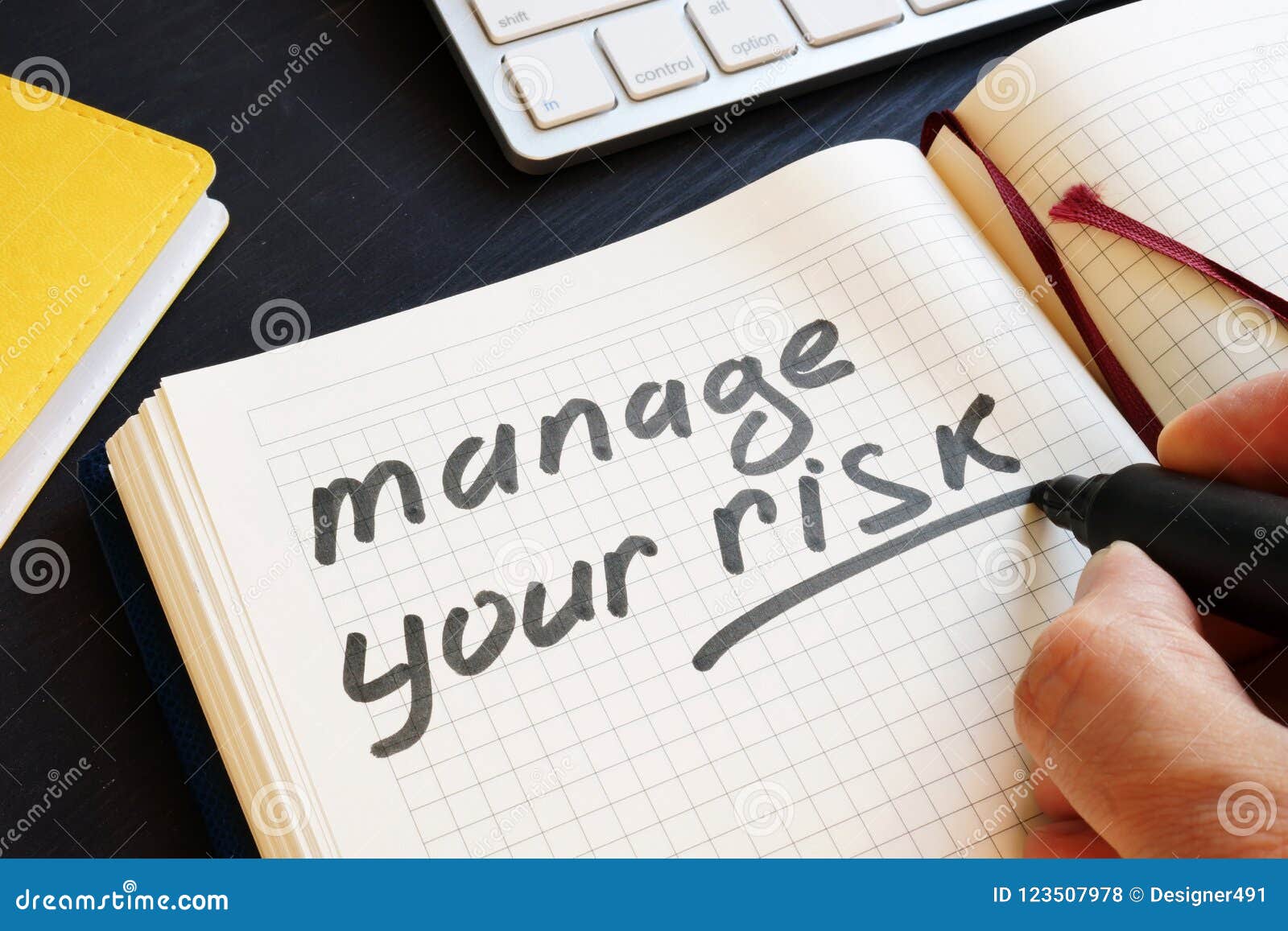 Man is Writing Manage Your Risk in a Note. Stock Photo - Image of ...