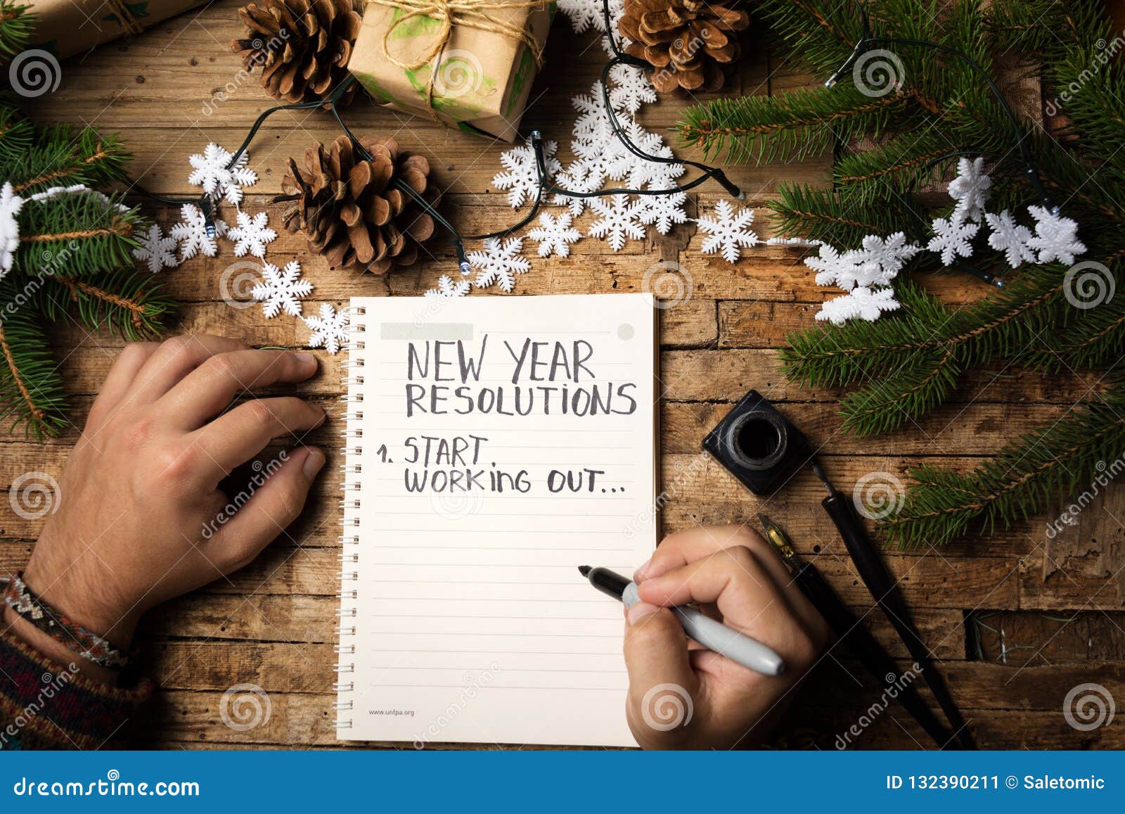 Man Writing New Year Resolution on Paper Stock Image - Image of ...