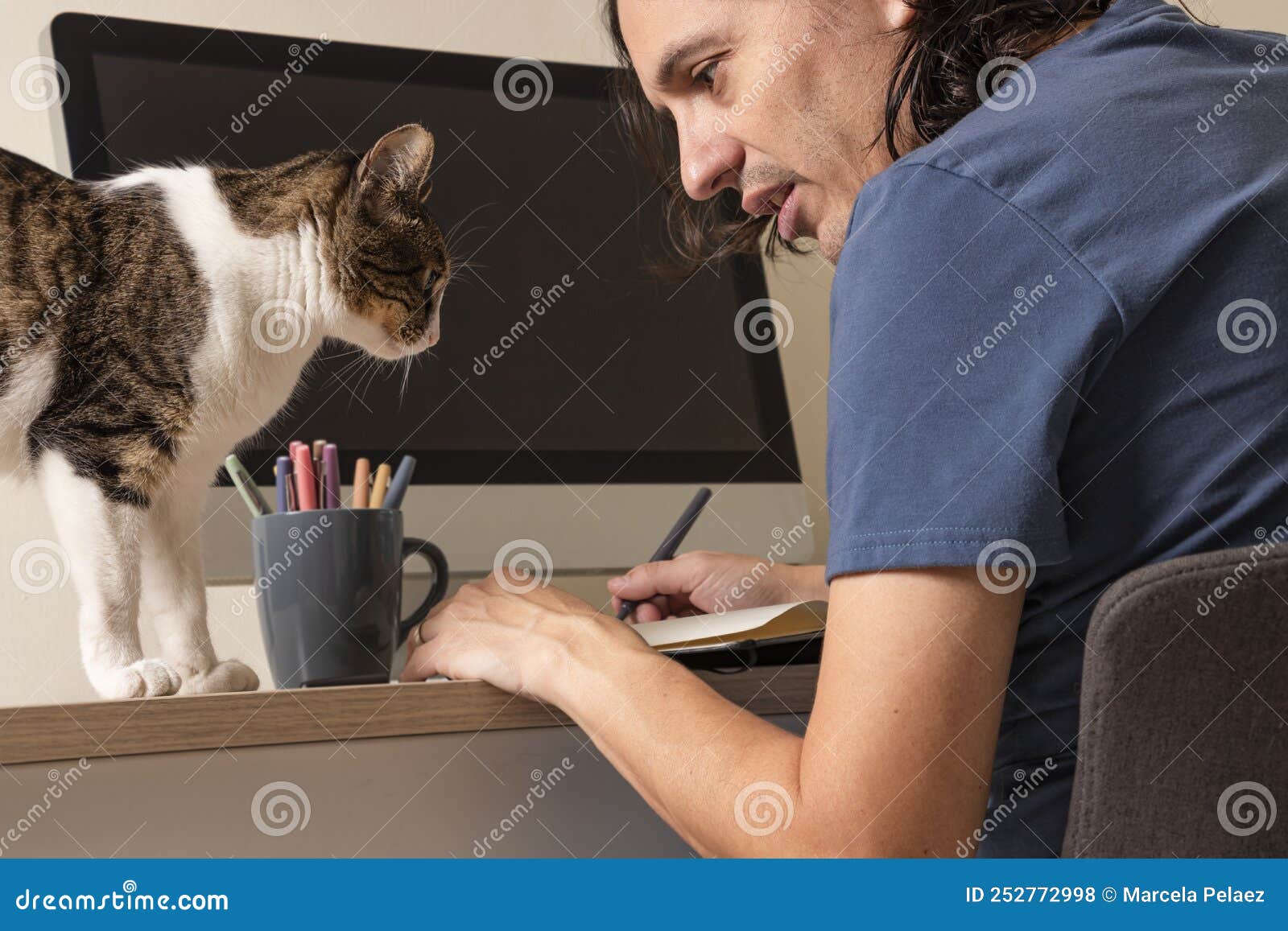 Man Writing in His Notebook Stock Photo - Image of focus, draft: 252772998