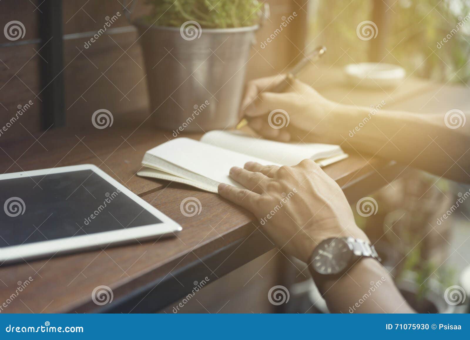 Man Writing on Notebook with Digital Tablet Stock Photo - Image of ...