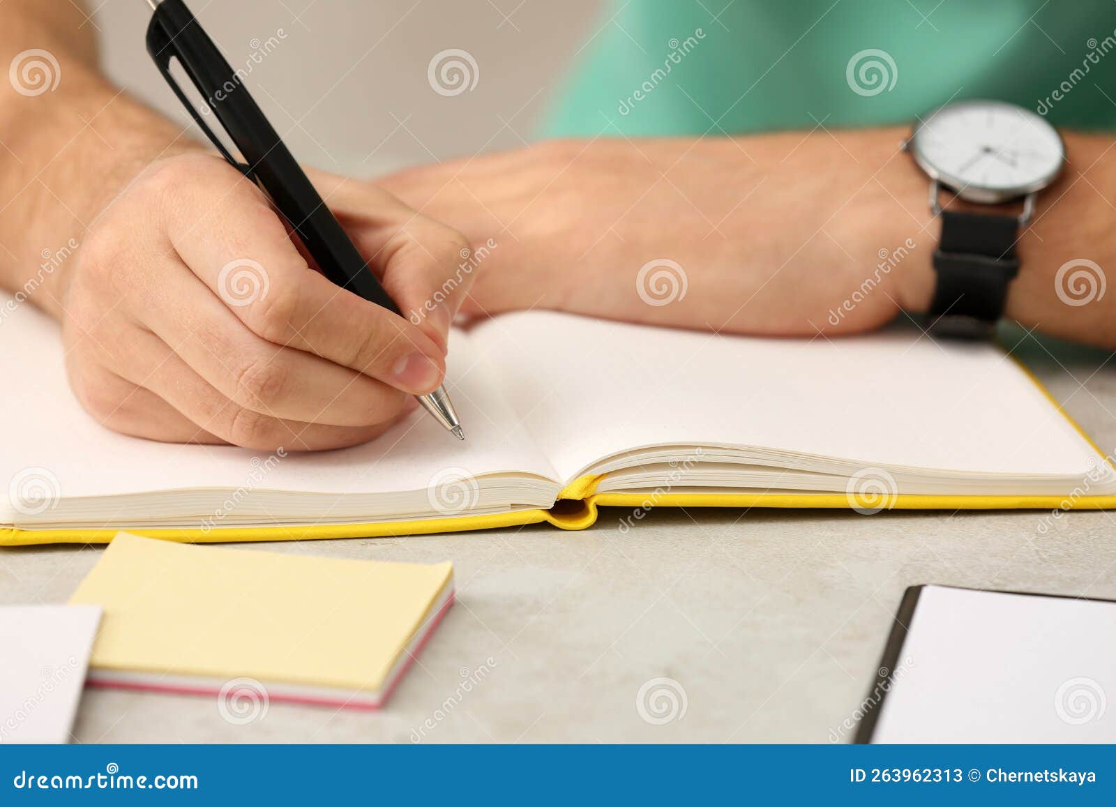 Man Writing in Notebook at Table Indoors, Closeup Stock Image - Image ...