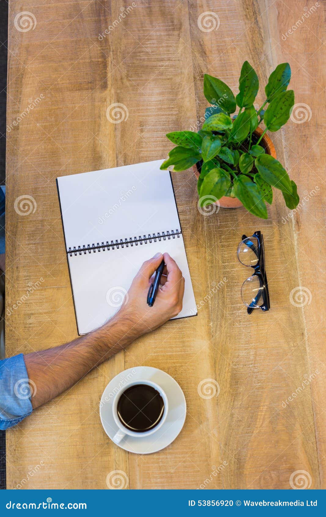 Man writing in notepad stock photo. Image of cool, shirt - 53856920