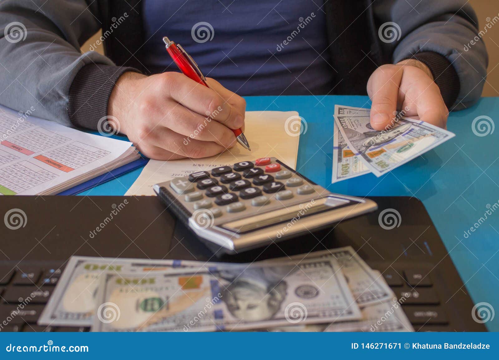 Man Writing Notes from Computer on Table. Man Hand with Pen, Calculator ...
