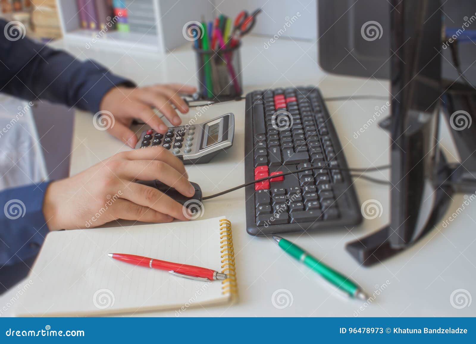 Man Writing Notes from Computer on Table. Man Hand with Pen, Calculator ...