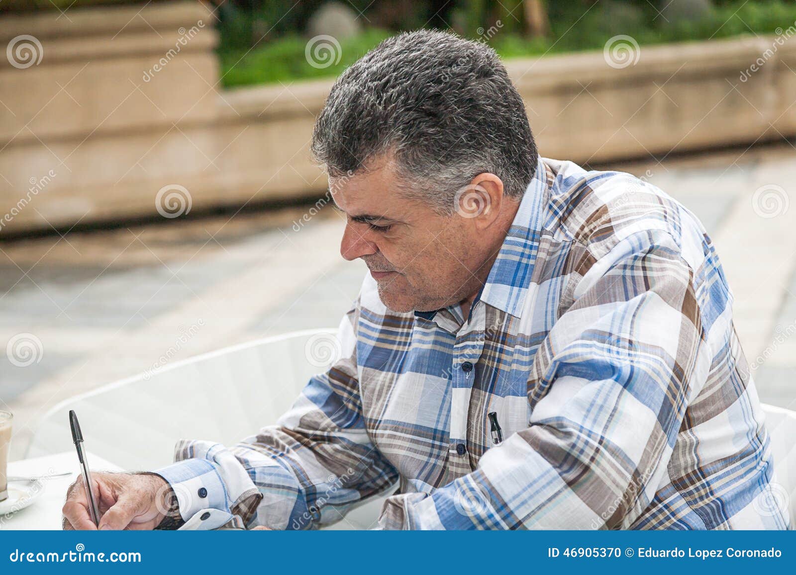 Man writing outdoors stock photo. Image of clothing, work - 46905370