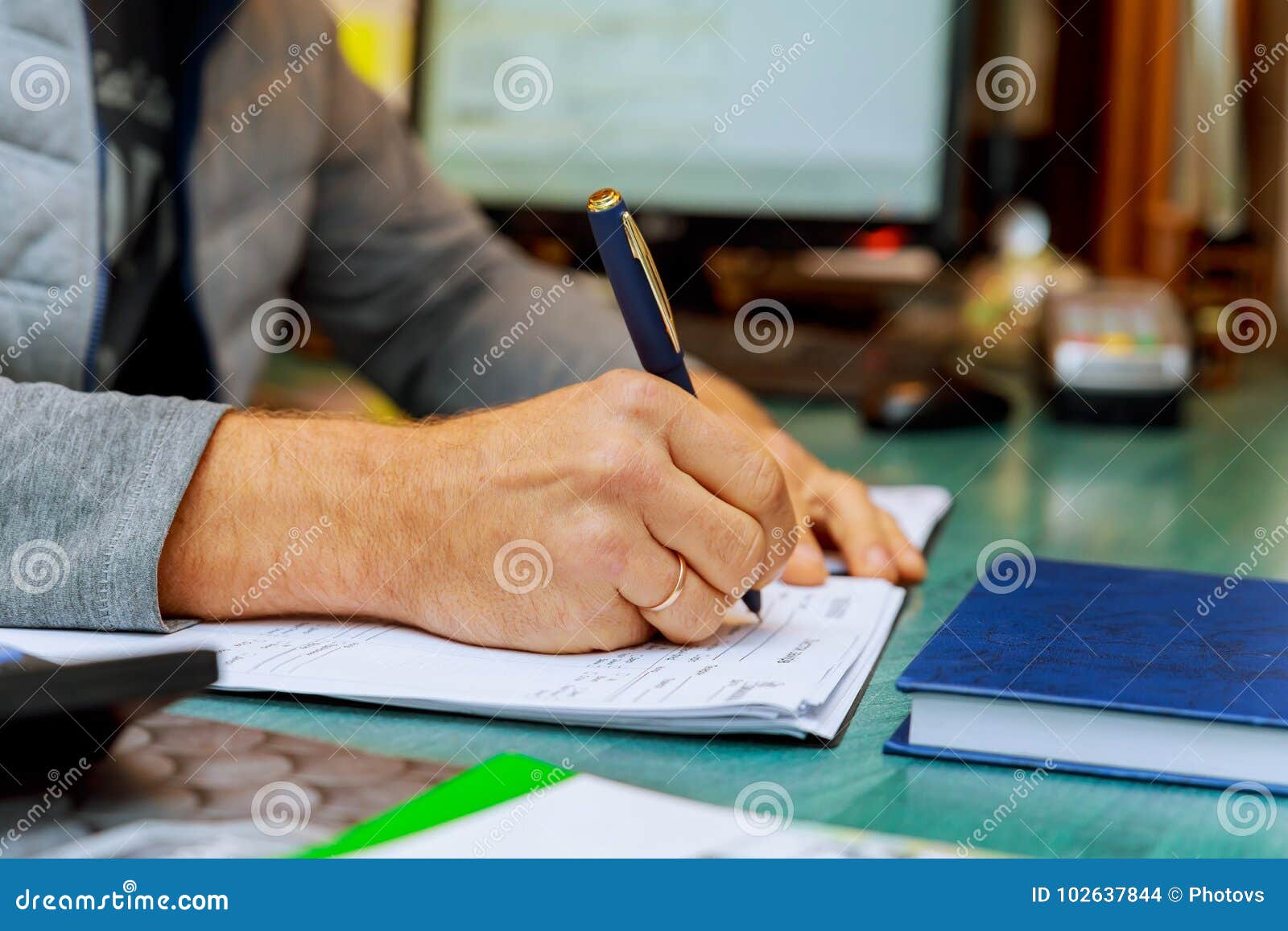 Man Writing on Paper with Pen on Table. Horizontally Framed Shot Stock ...