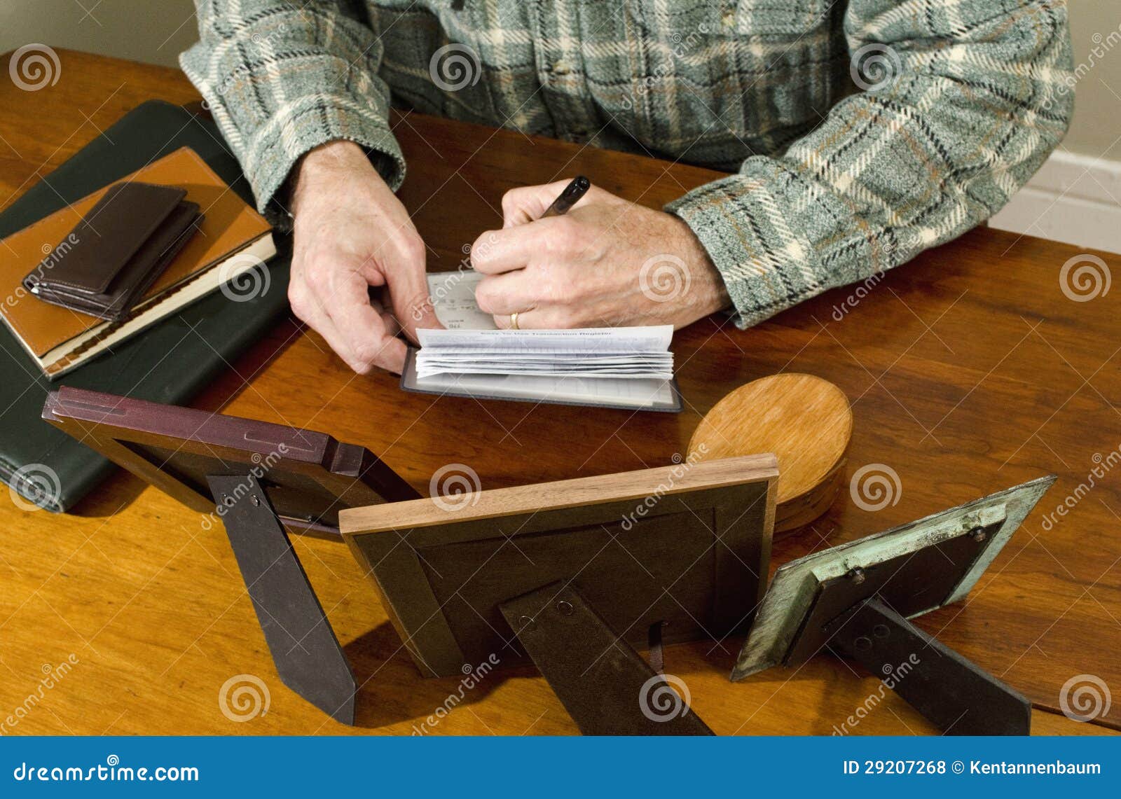 Man writing personal check stock photo. Image of plaid - 29207268