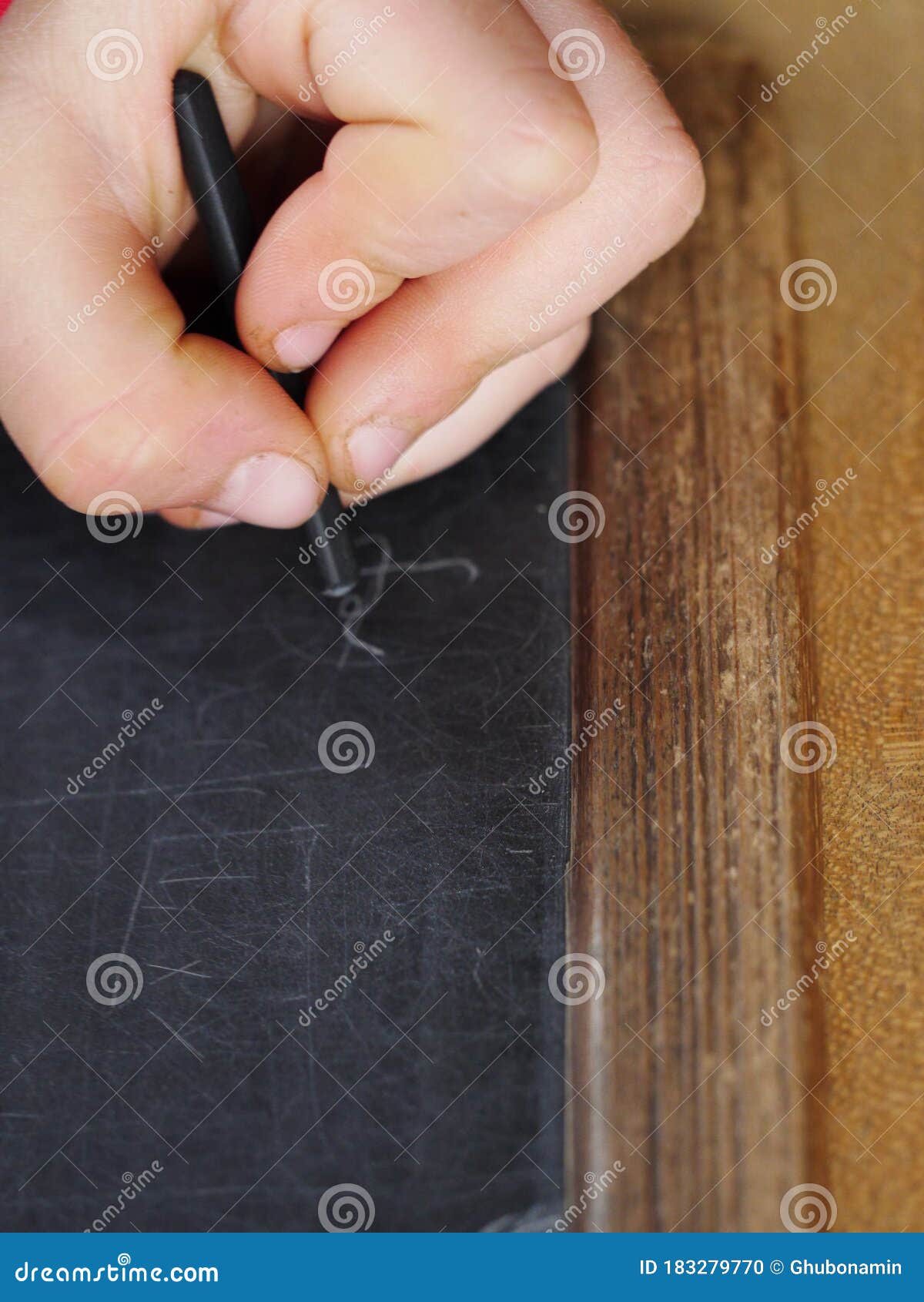 Man writing on a slate stock photo. Image of decorative - 183279770