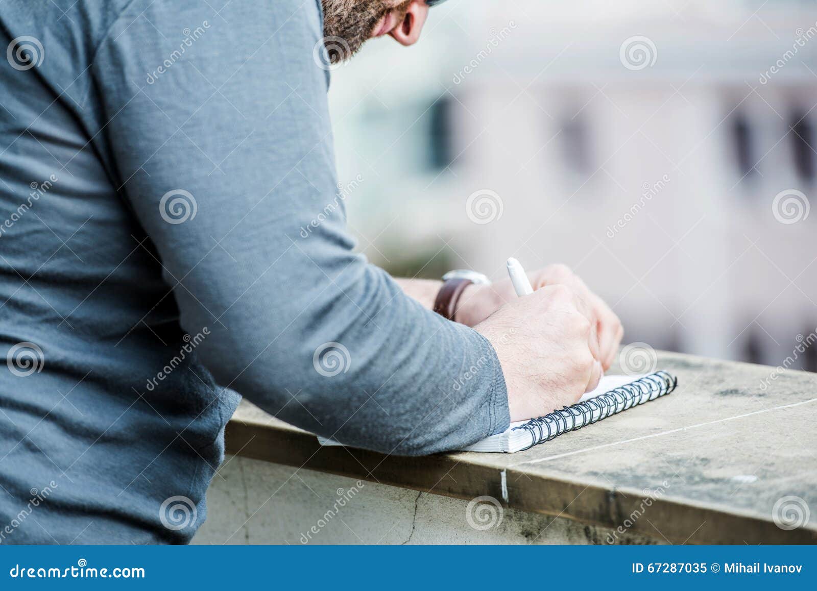 Man Writing Something on a Notebook - Close Up Side View Stock Image ...