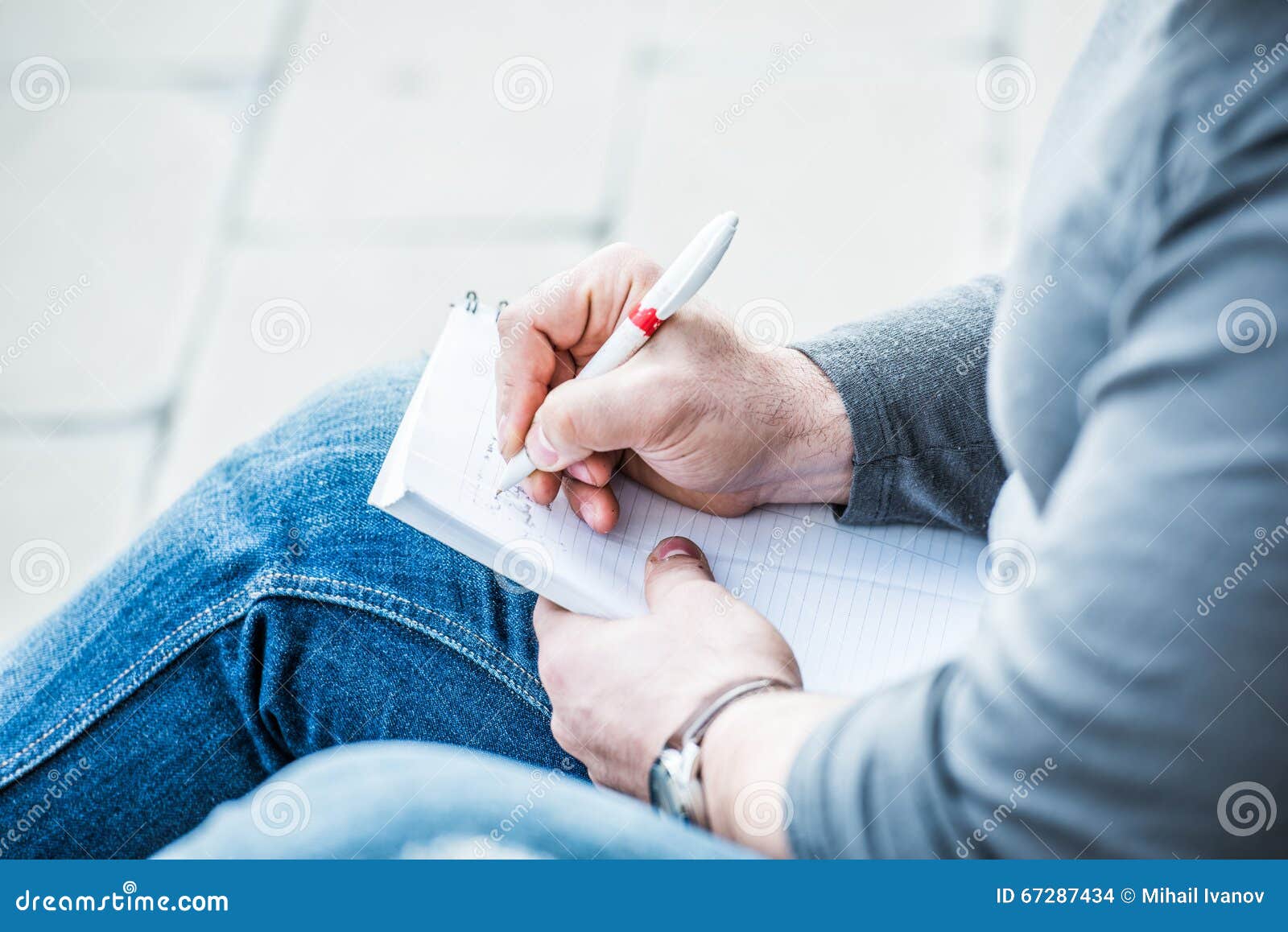 Man Writing Something on a Notebook - Side View Stock Photo - Image of ...