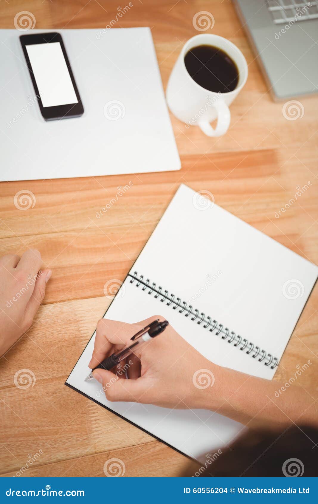Man Writing on Spiral Notebook at Desk in Office Stock Photo - Image of ...