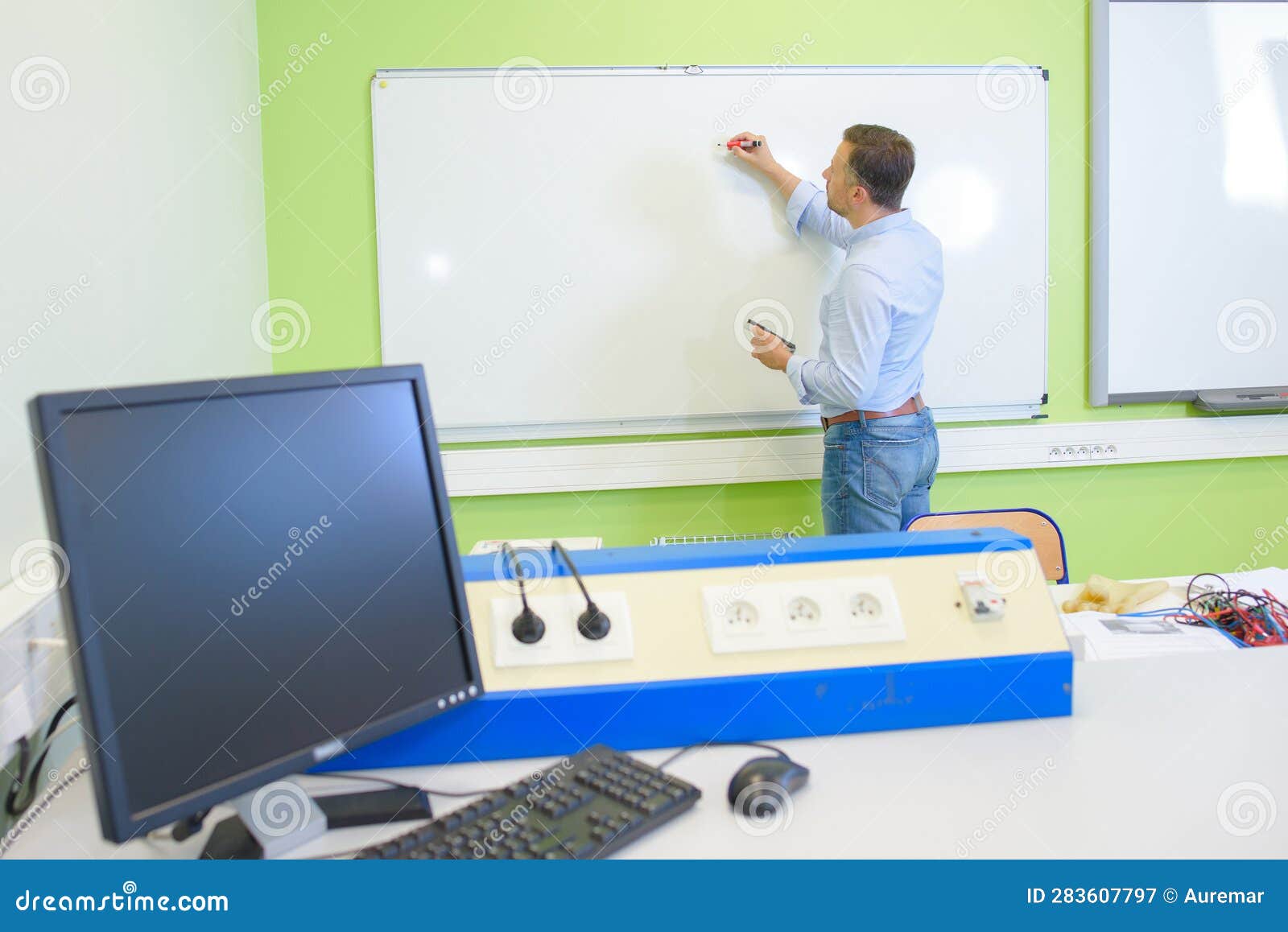 Man writing on whiteboard stock image. Image of board - 283607797