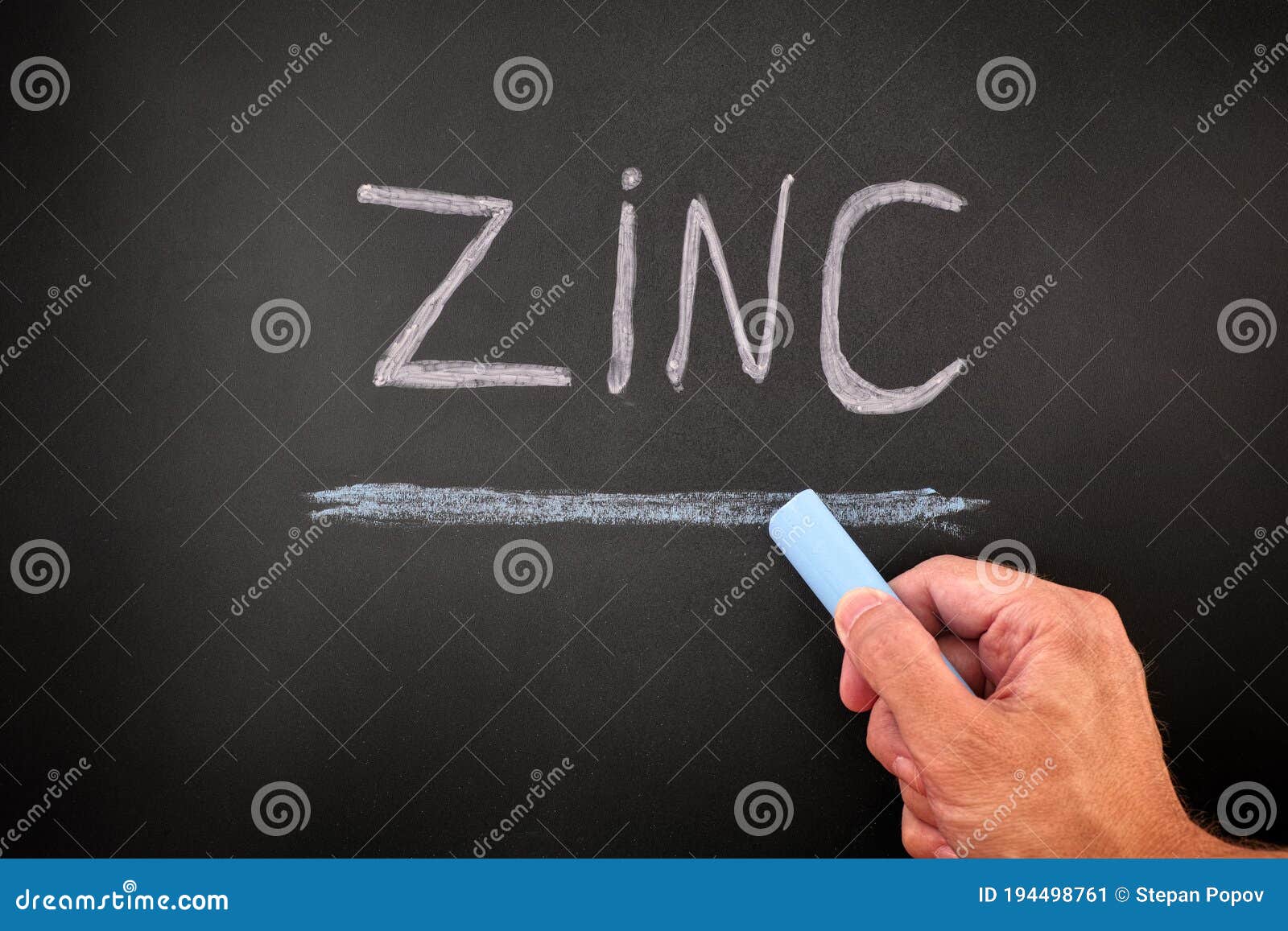Man Writing the Word Zinc on a Chalkboard Stock Image - Image of ...