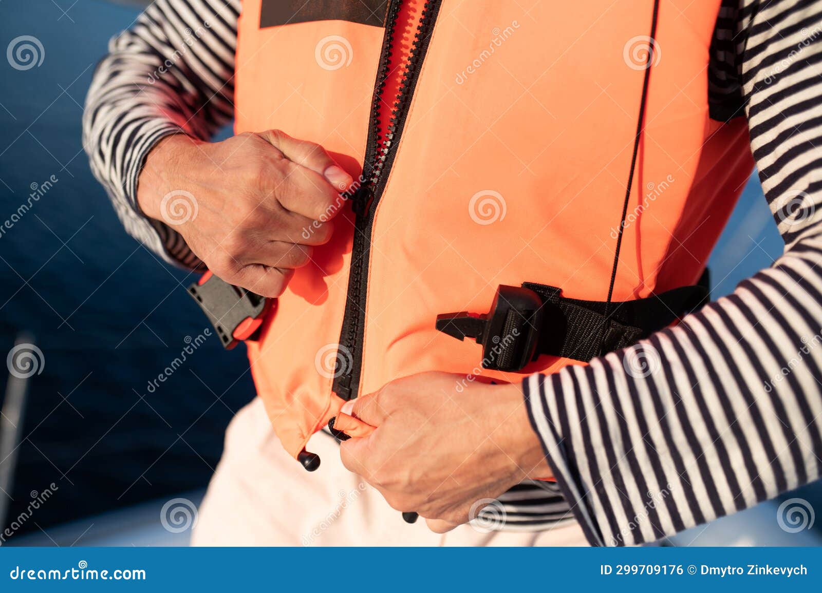 Man on a Yacht Putting on a Life Jacket Stock Photo - Image of healthy ...