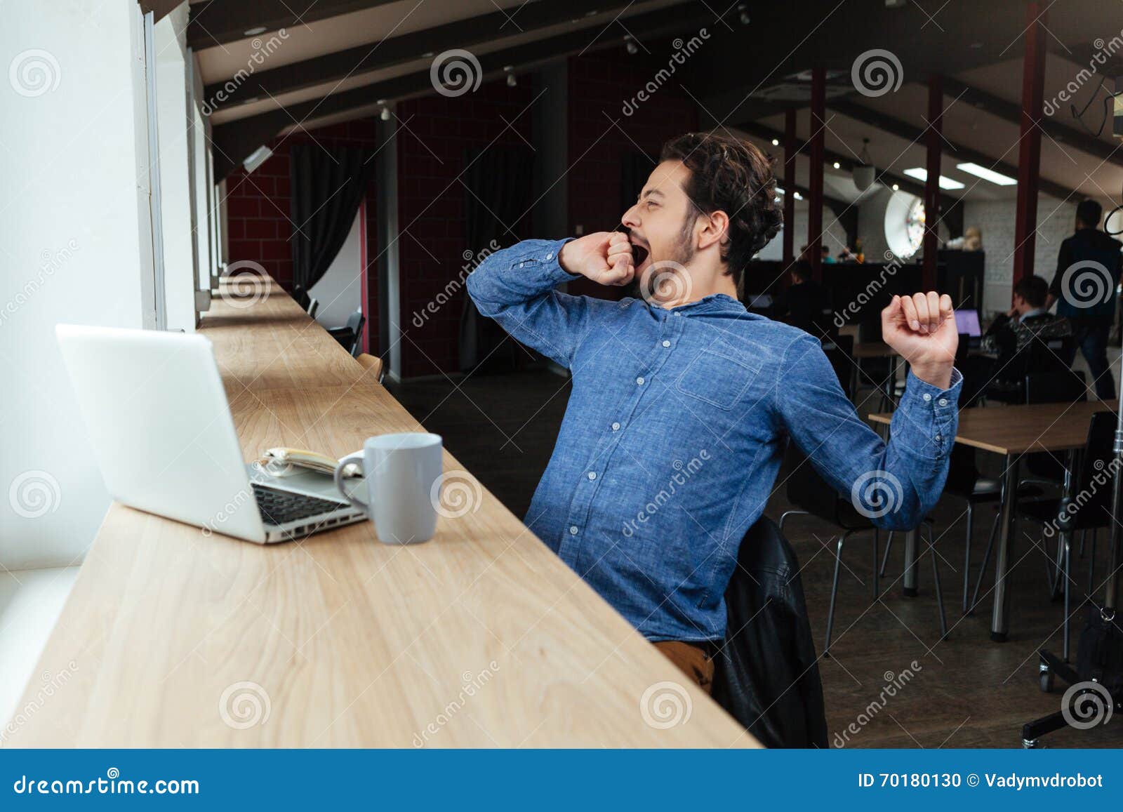 Man yawning in cafe stock photo. Image of cloth, addict - 70180130